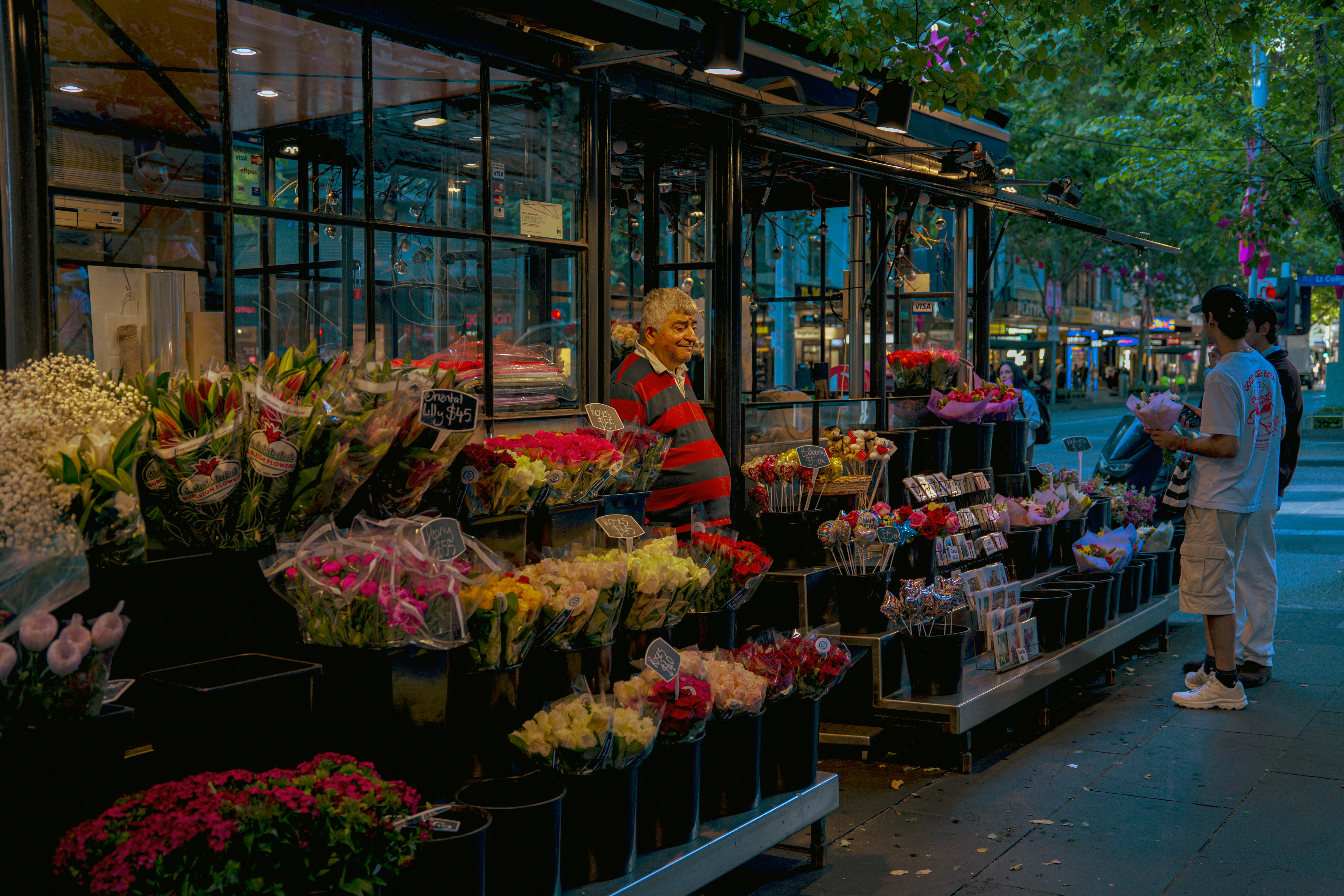 Market Stand in Evening Light: A Florist at Dusk