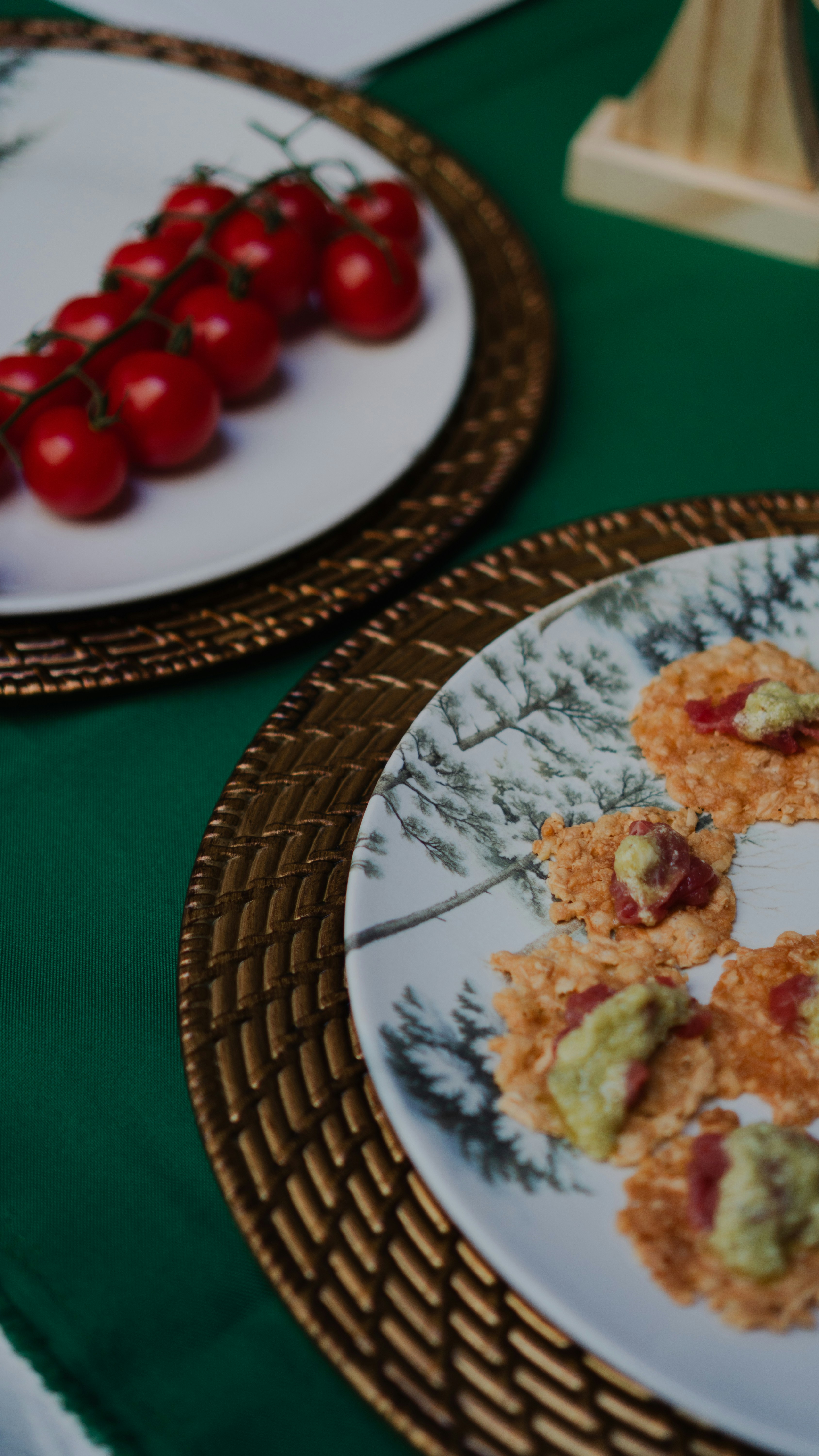Cherry On A Plate: A Close-Up of Festive Snacks on Green Linen