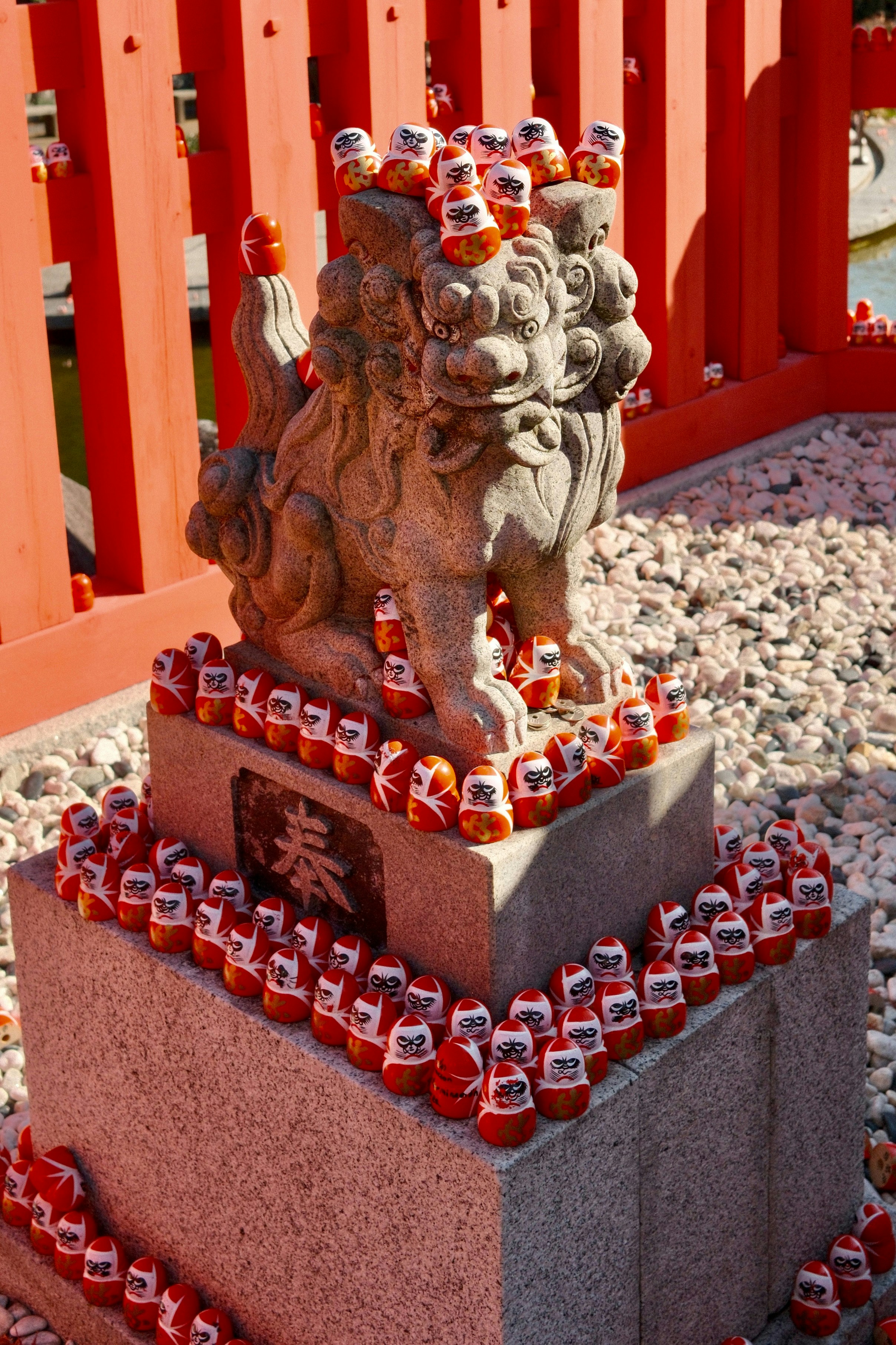 Stone Guardian Surrounded by Daruma Row