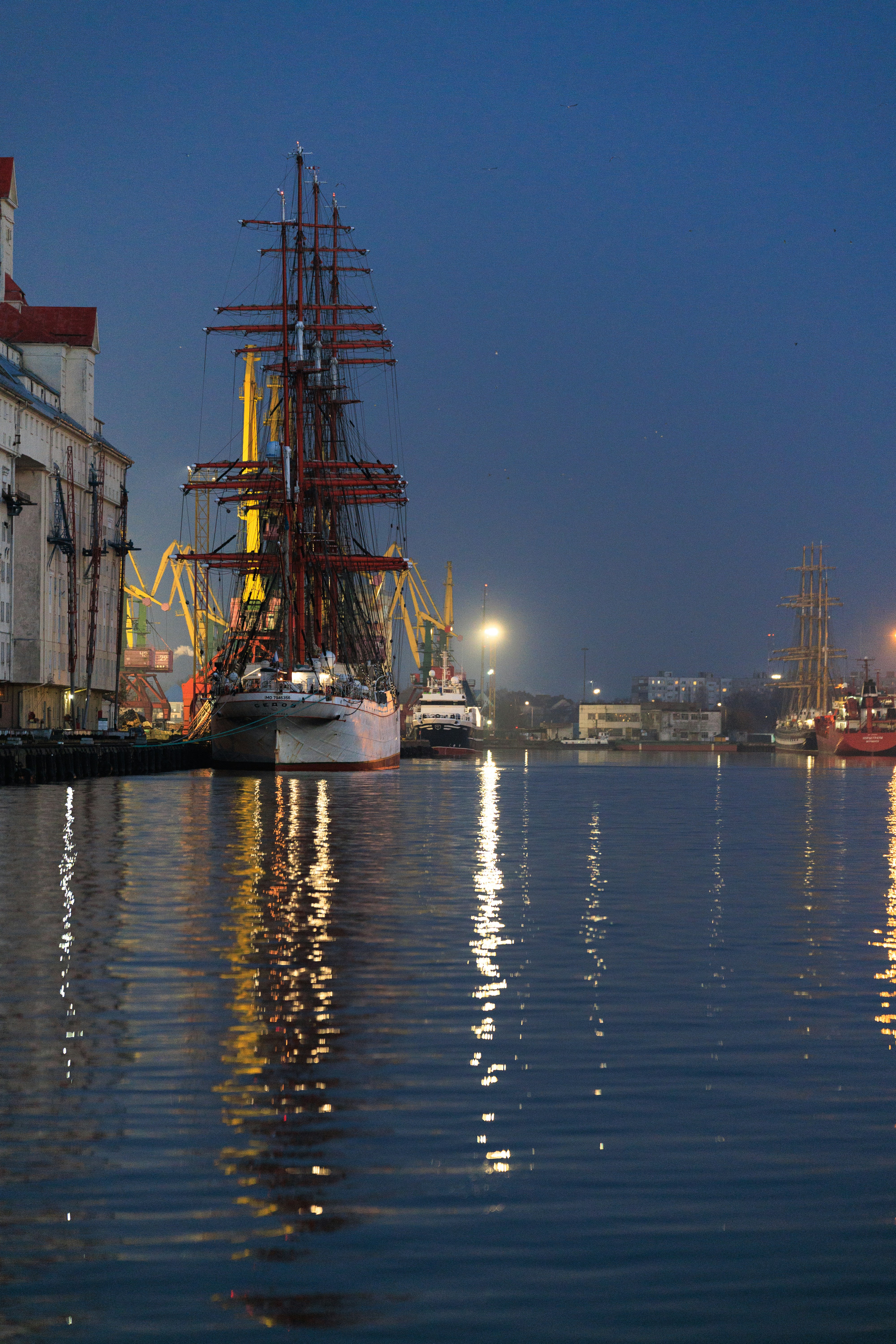Harbor Twilight: Tall Ships at the Quiet Dock