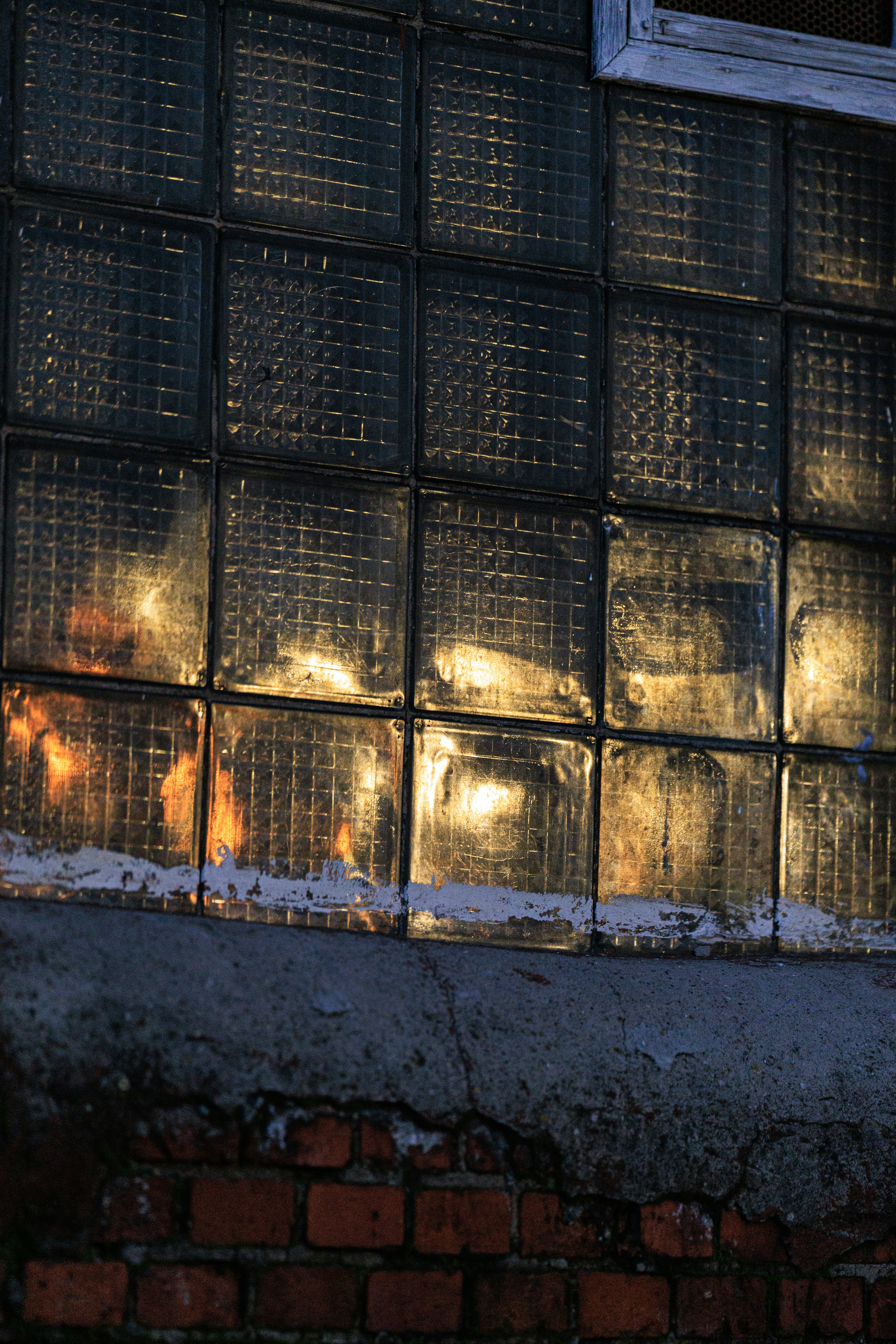 Glazed Grid at Dusk: Echoes of Light in Glass Blocks