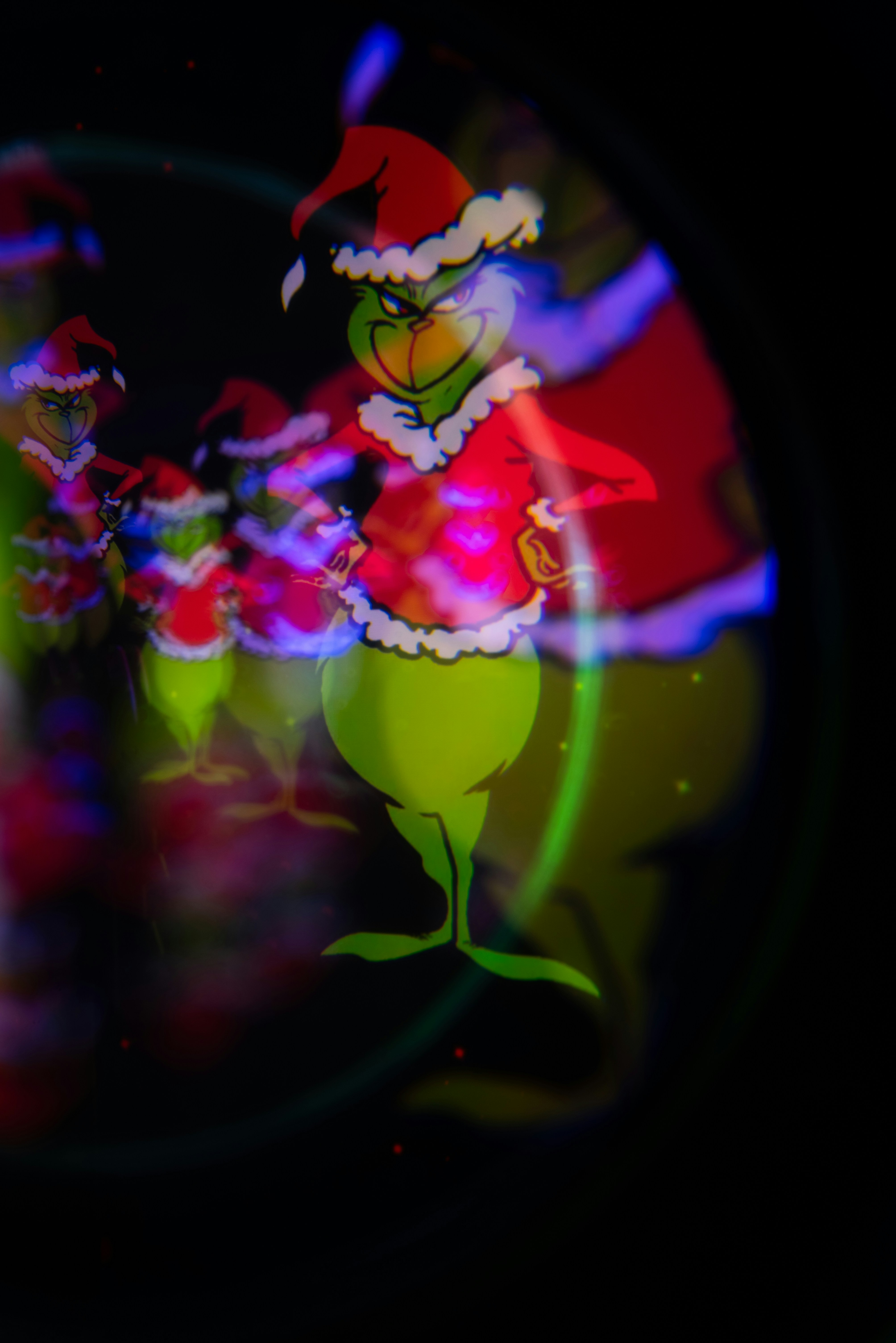 Neon Grin: Santa Grinch in a Kaleidoscope of Christmas Light