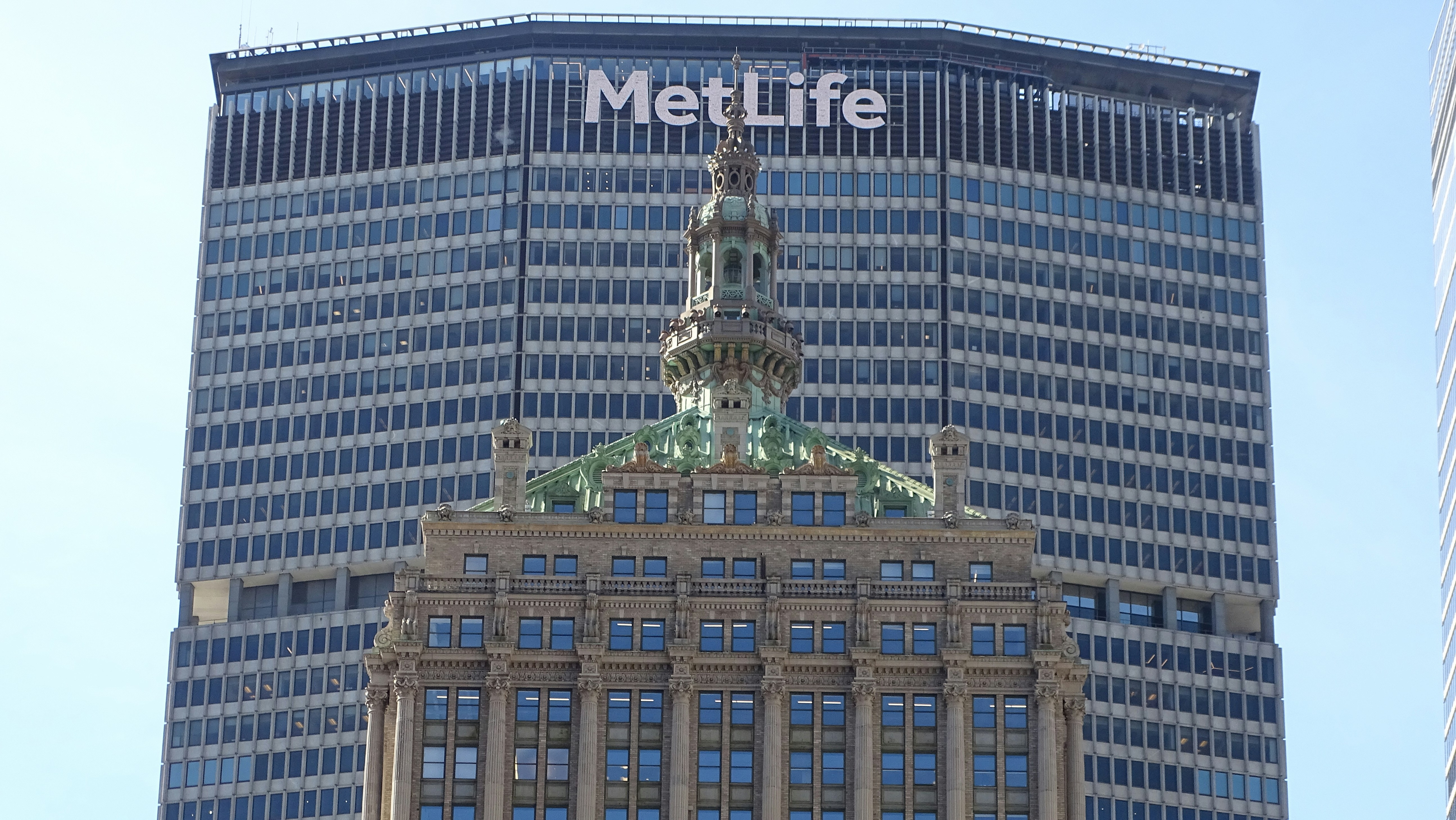 Skyward Portrait: The MetLife Gilded Facade Under a Modern Glass Crown