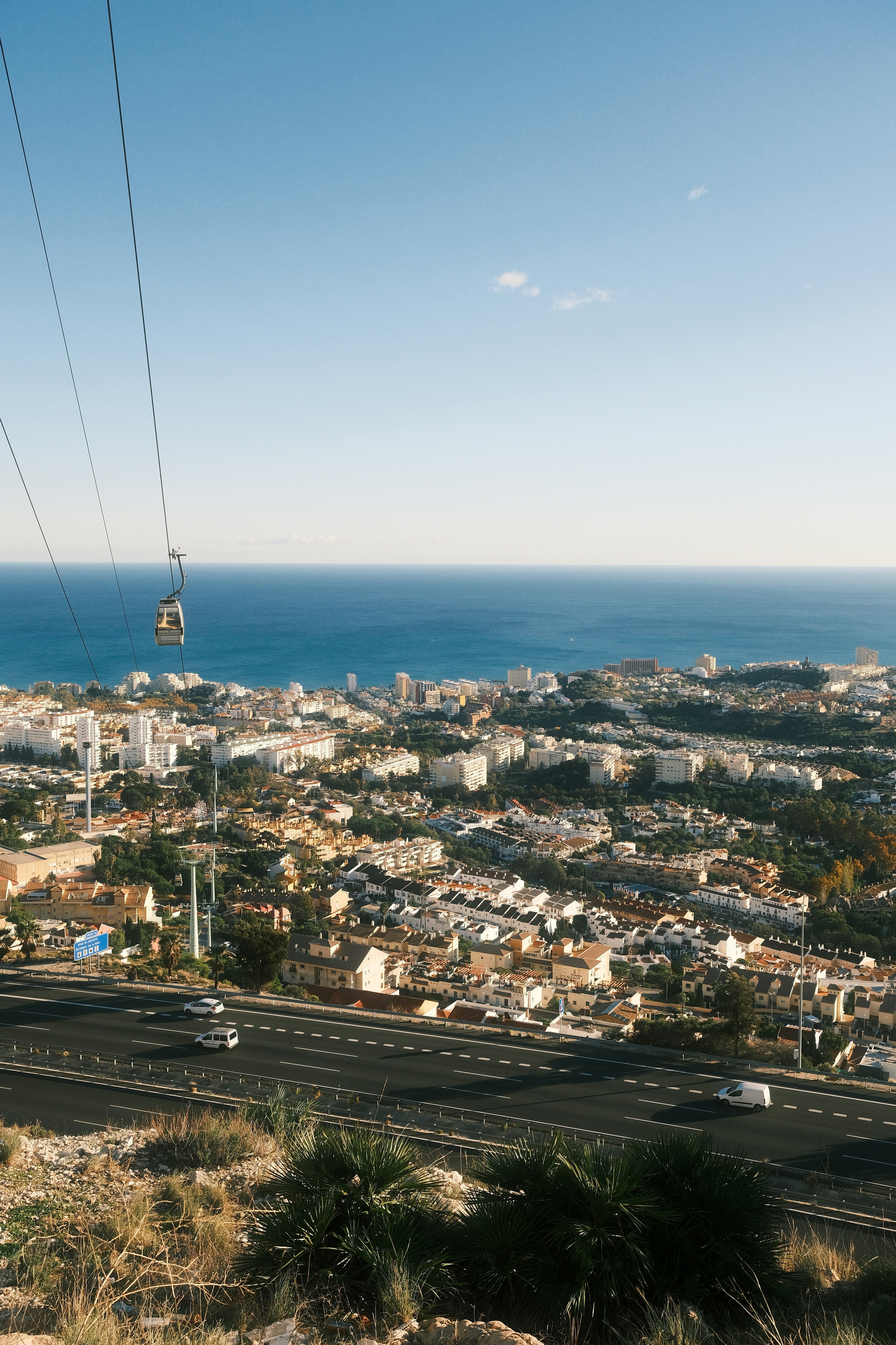 Cable Car Panorama: Foothills, Sea, and Suburban Grid