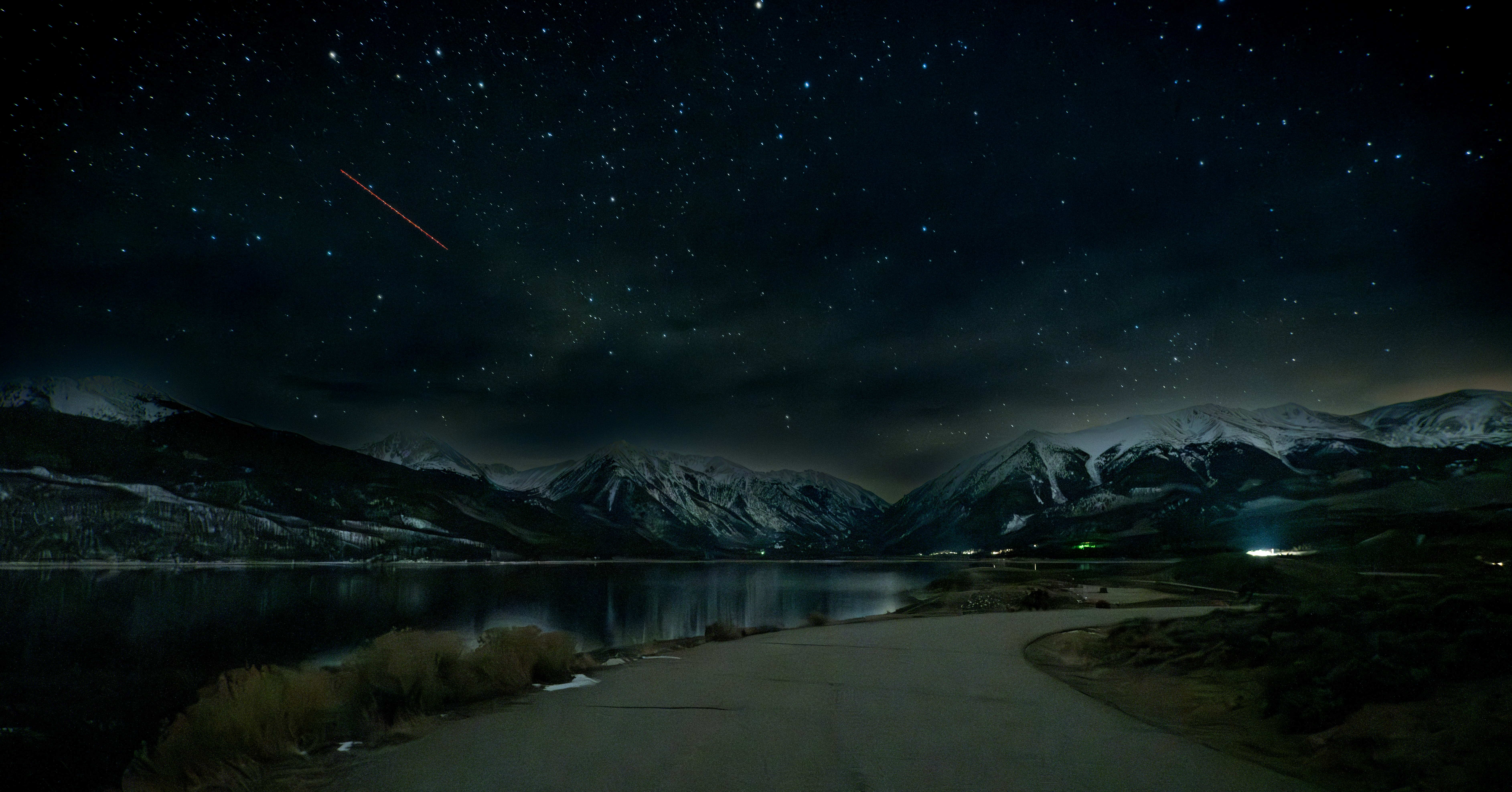 Stellar Veil Over a Quiet Mountain Lake