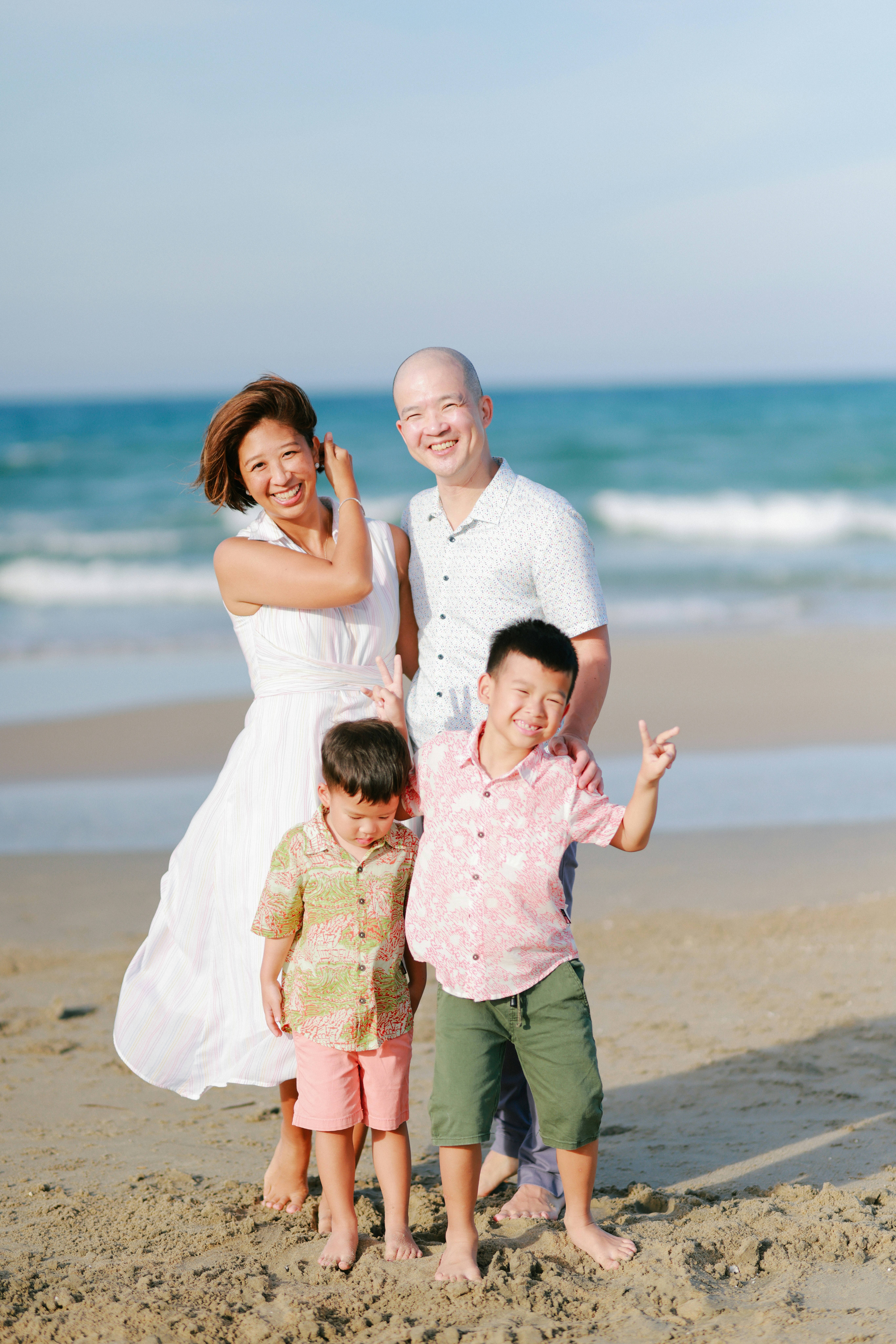 Family Sandscape: Laughter in the Ocean Breeze