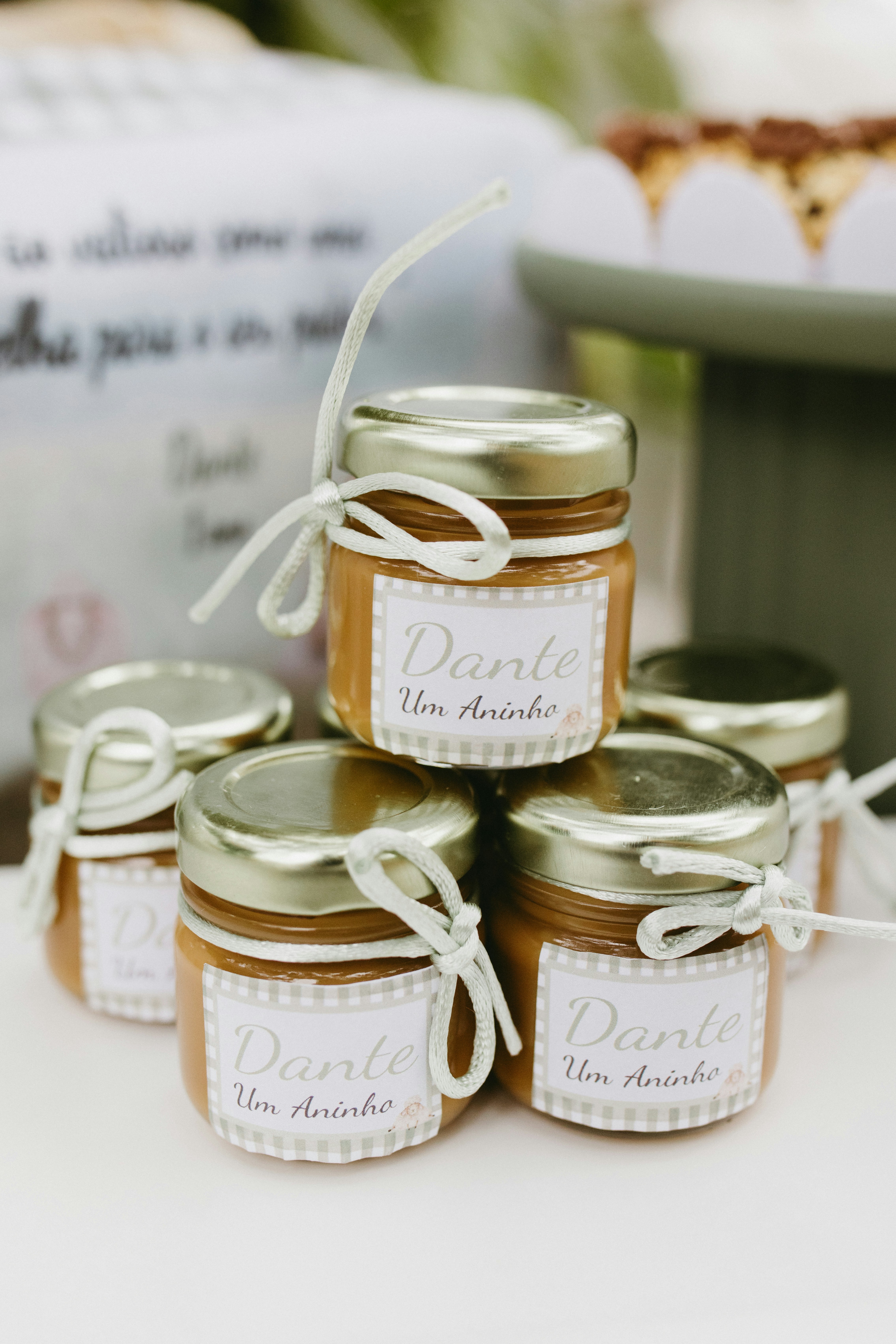 Small jars of caramel candy tied with white ribbonJonathan Borba