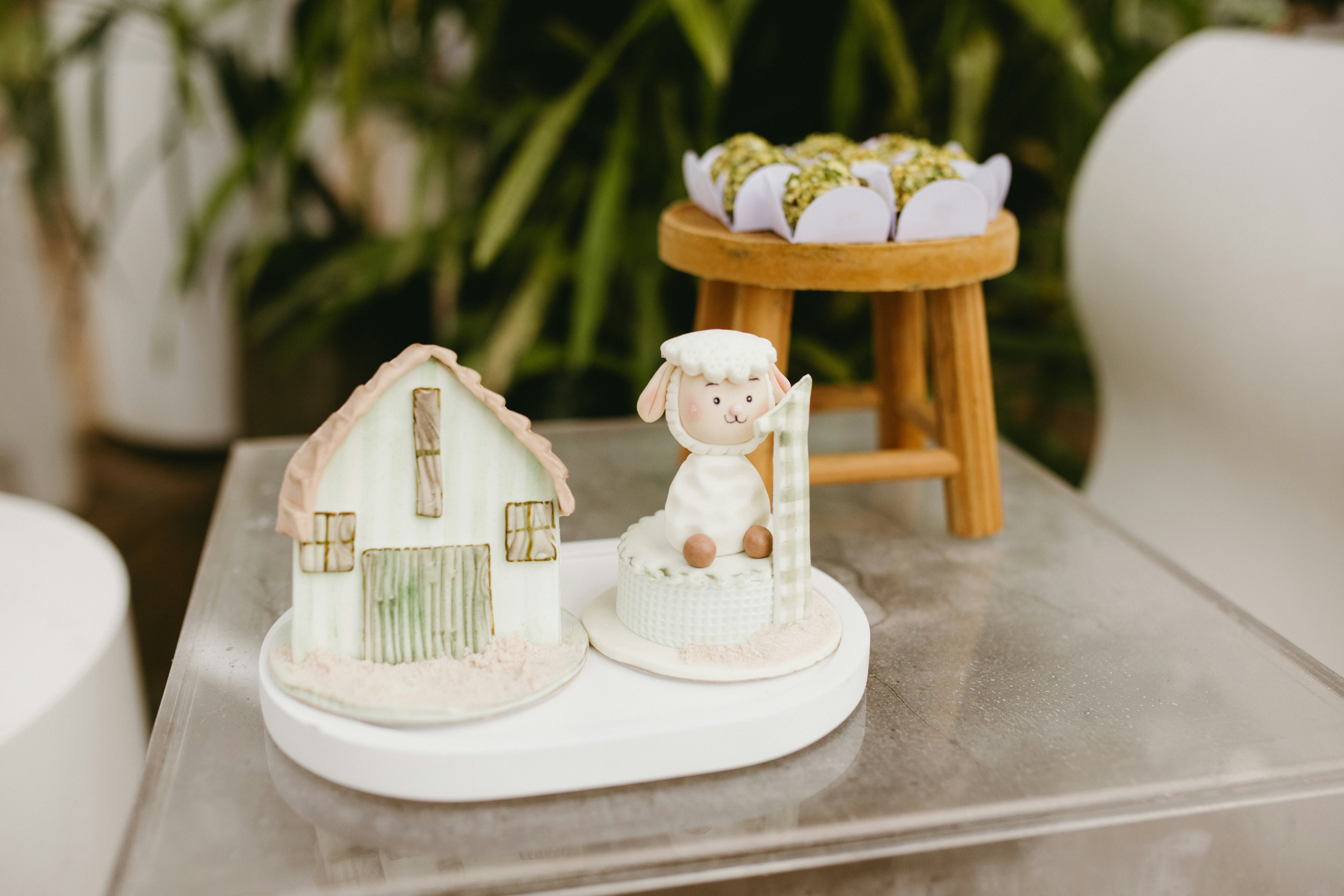 Pastel Village on a Tabletop: Delicate Cakes Around a Wooden Stool