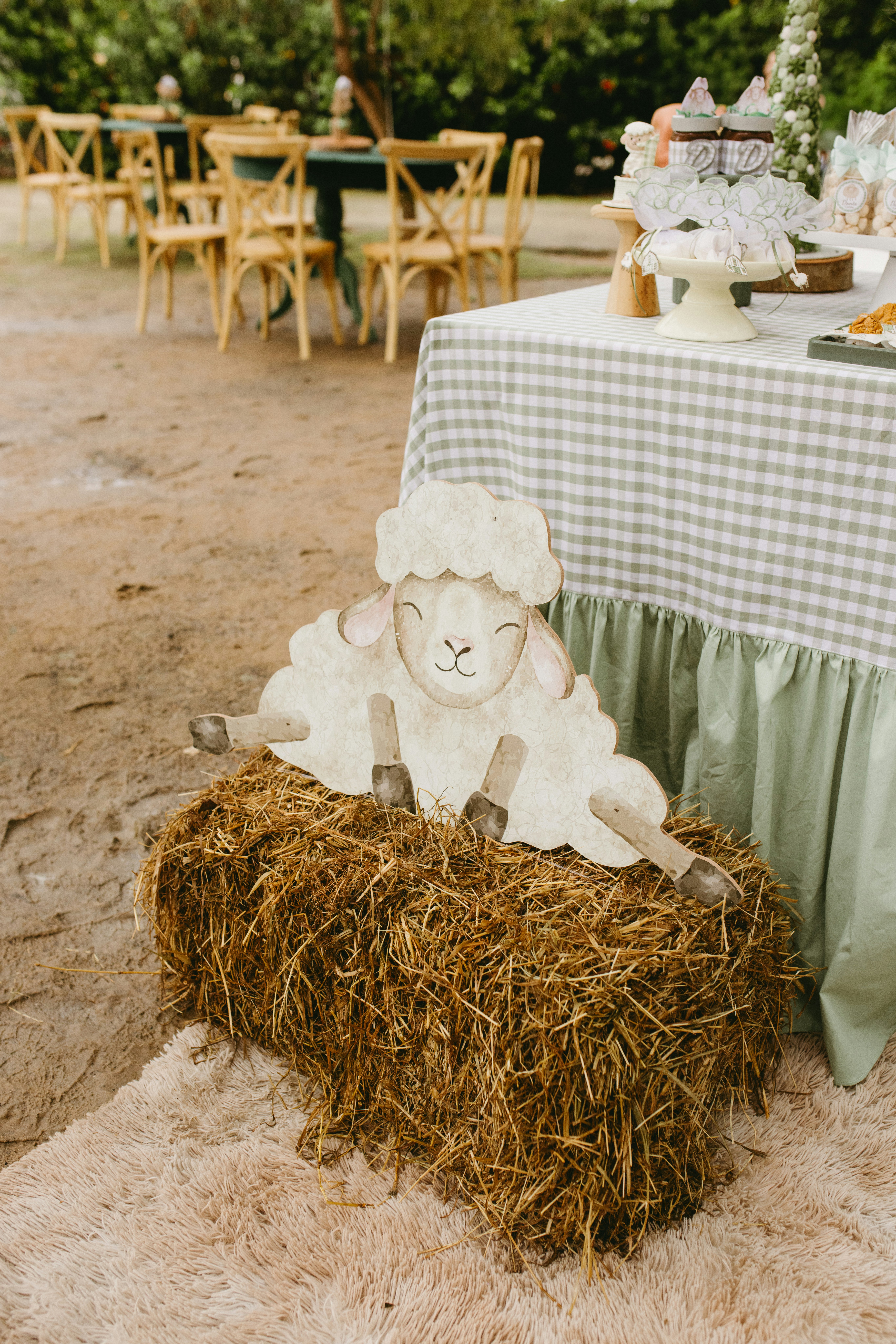 Pastoral Party: A Lamb-Shaped Prop and Dessert Stack Guard a Garden Table