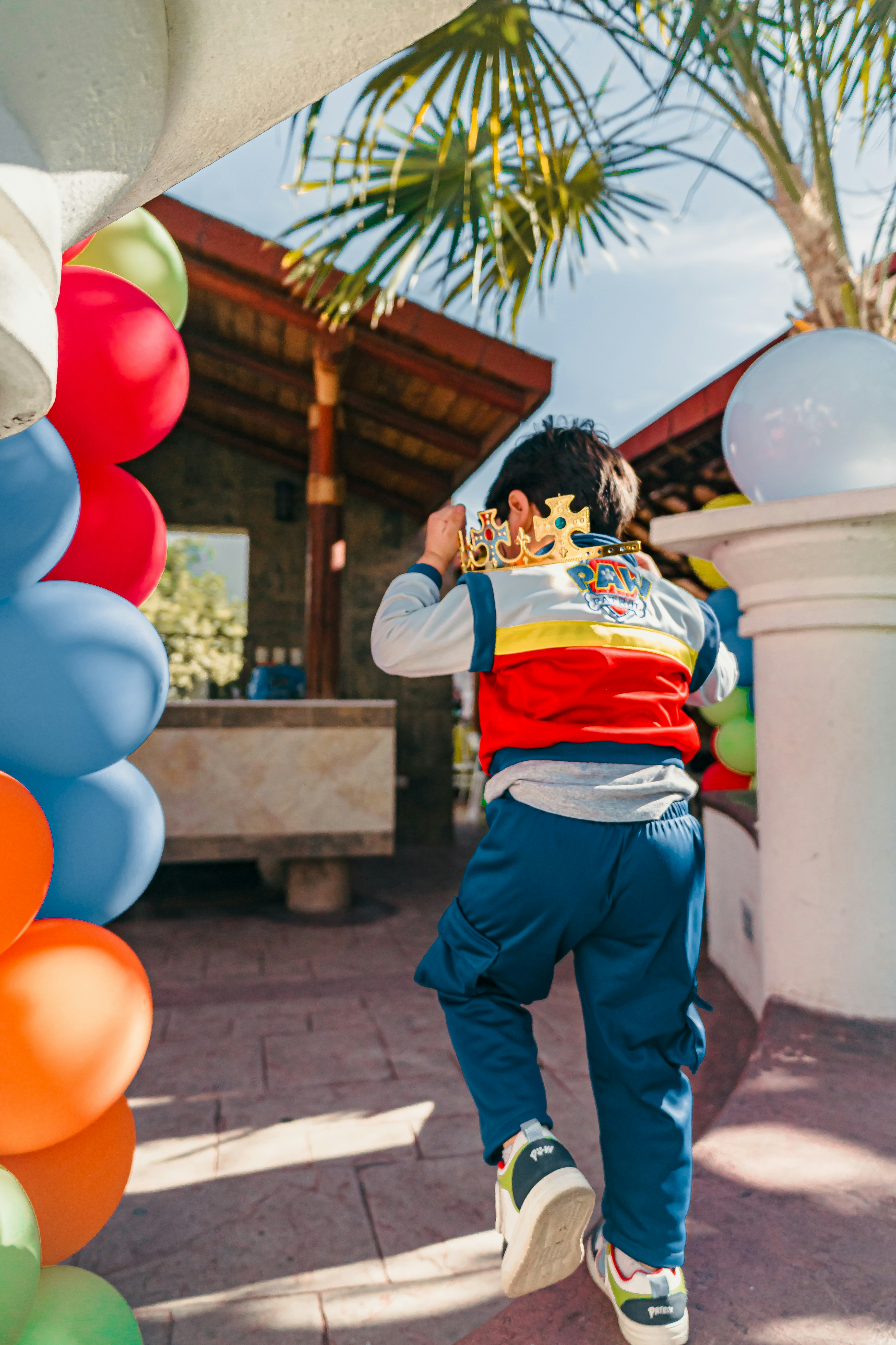 Child in Colorful Celebration Stepping Toward Adventure