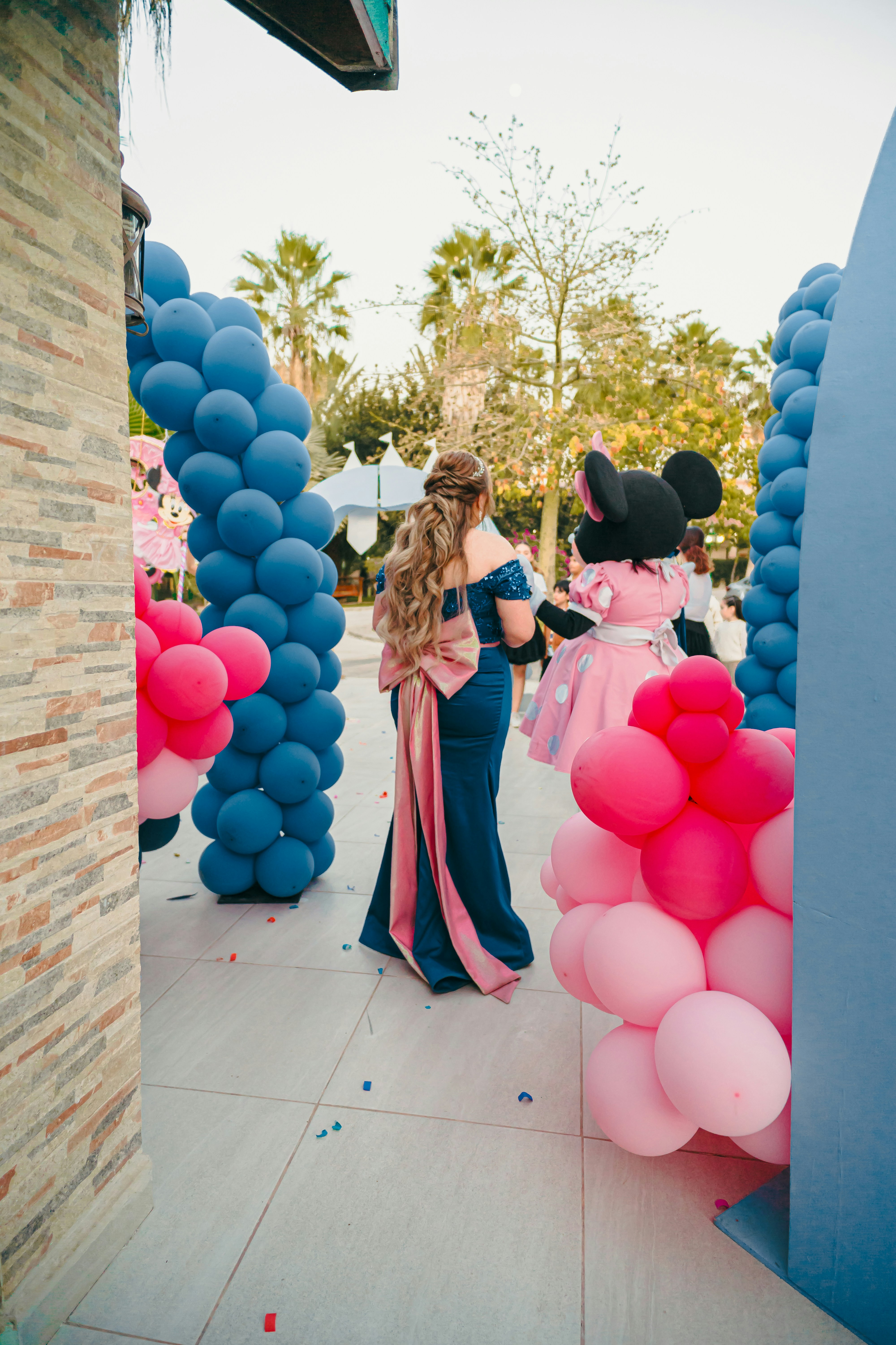 Balloon-adorned stroll: princesses in a garden party