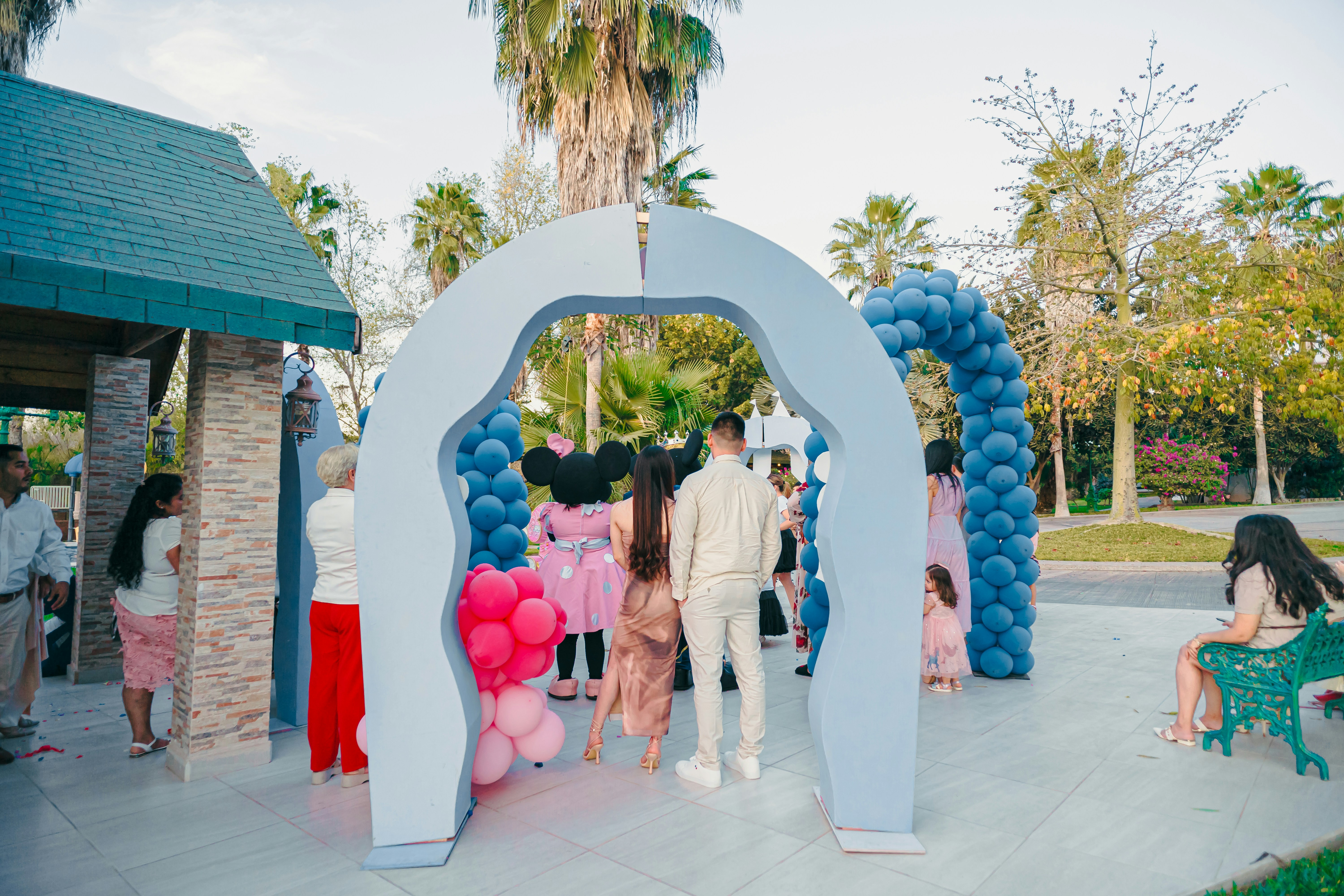 Archway of Celebration: A Balloon-Decorated Gathering in the Courtyard