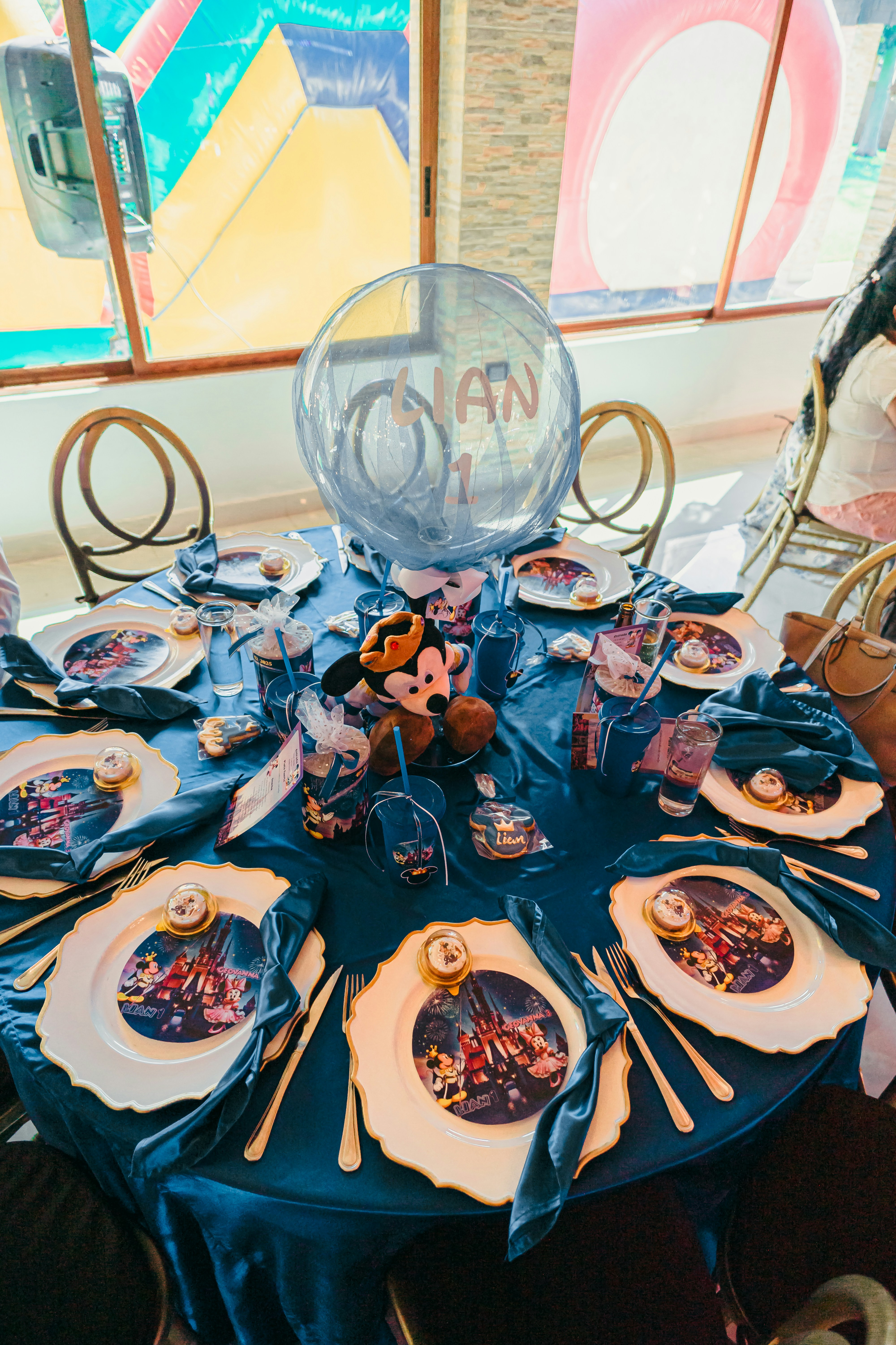 Disney-themed Round Table Celebration Under Balloon Centerpiece