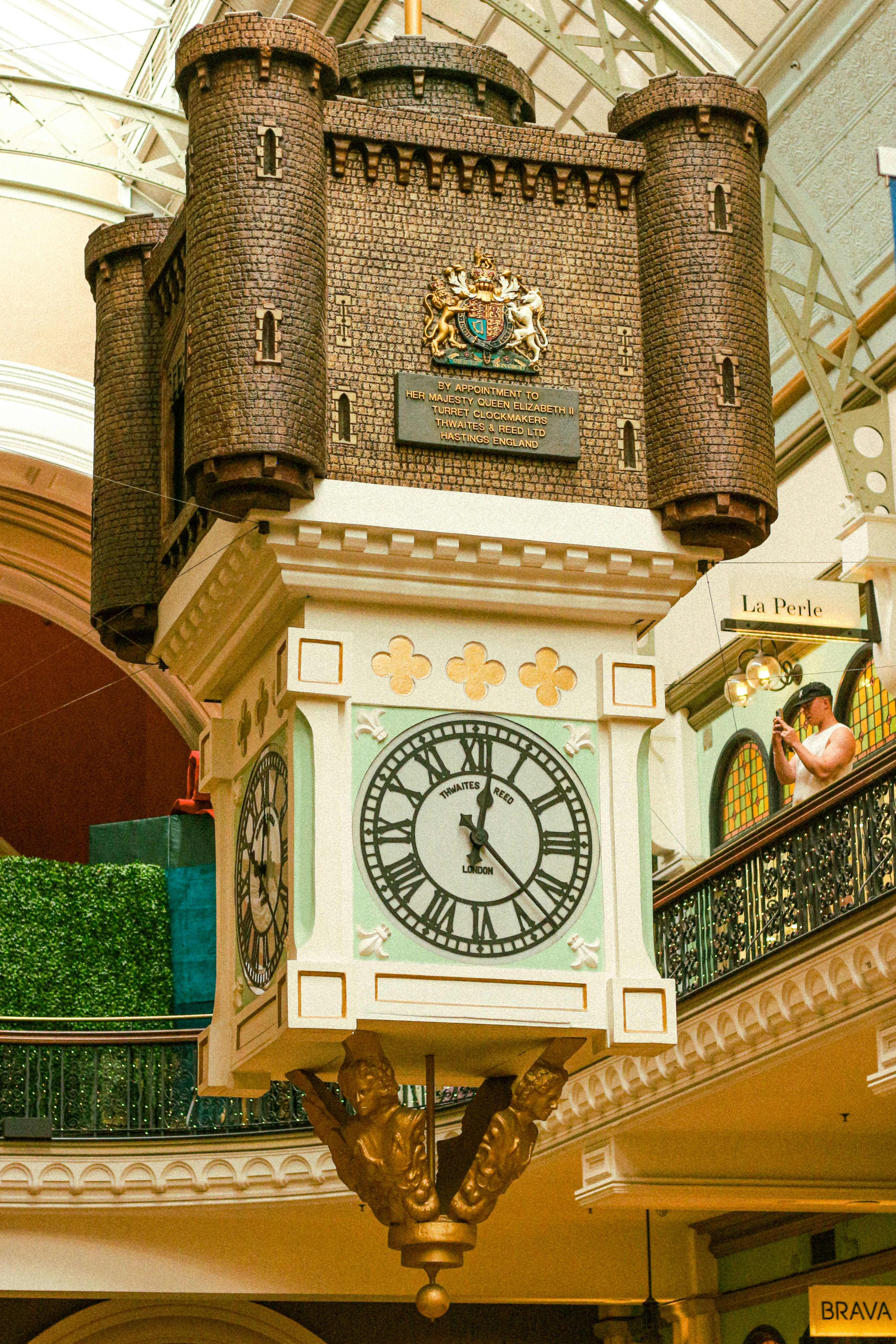 Heraldic Clocktower: A Whimsical Timepiece Anchoring the Grand Hall