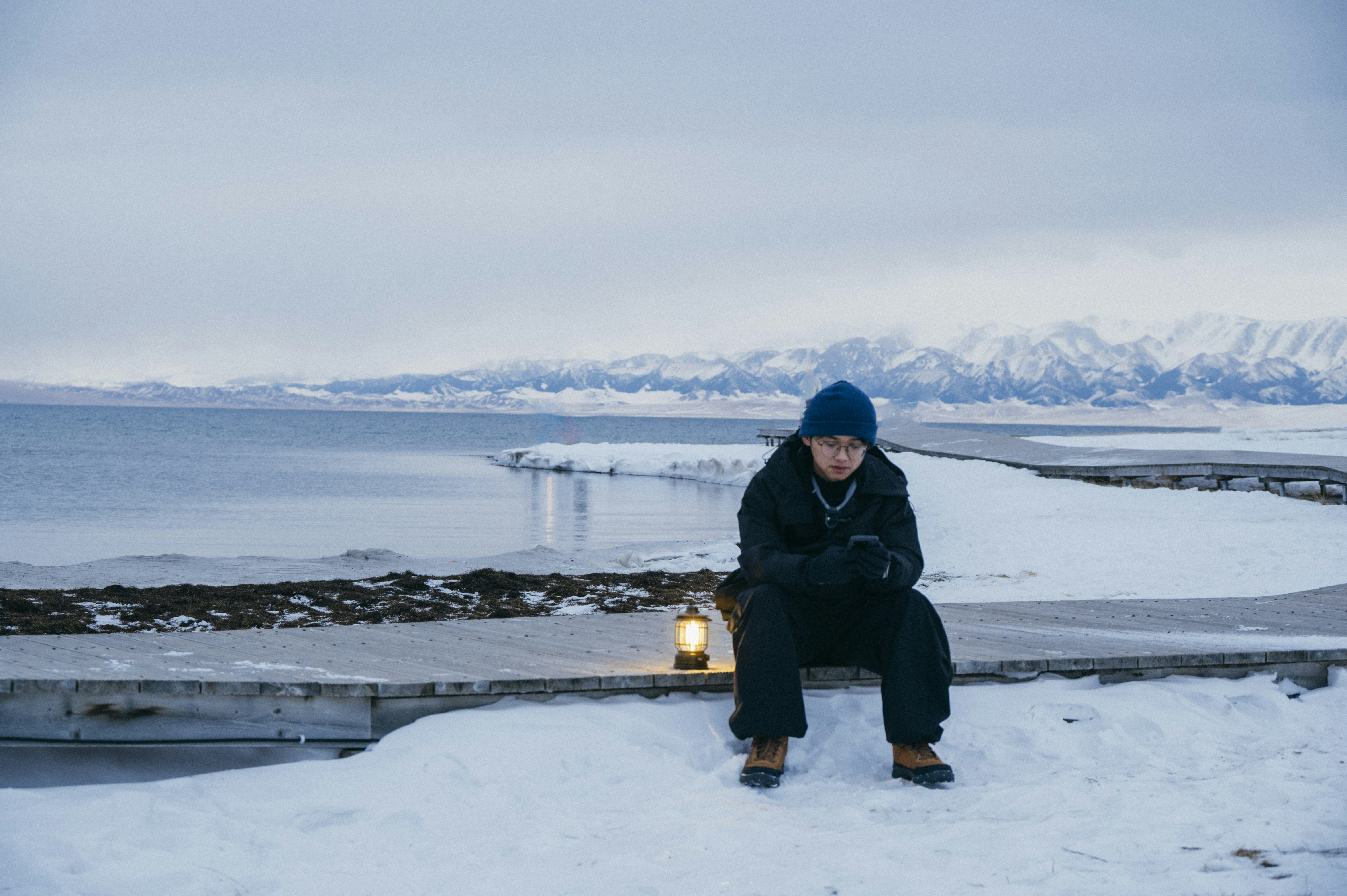 Solitary Fisherman at Distant Fjord