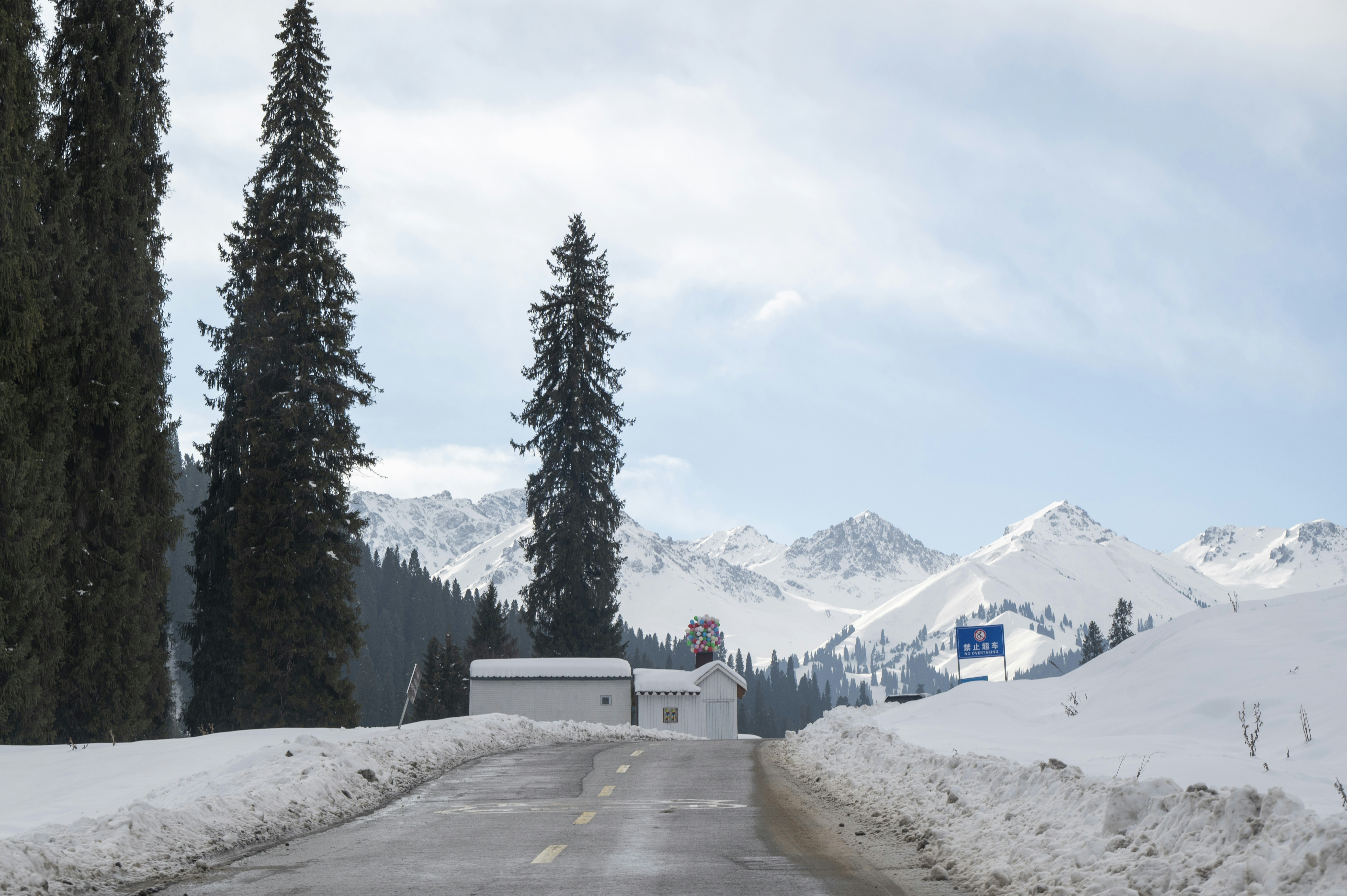 Snowbound Gate: A Quiet Mountain Pass on a Clear Day