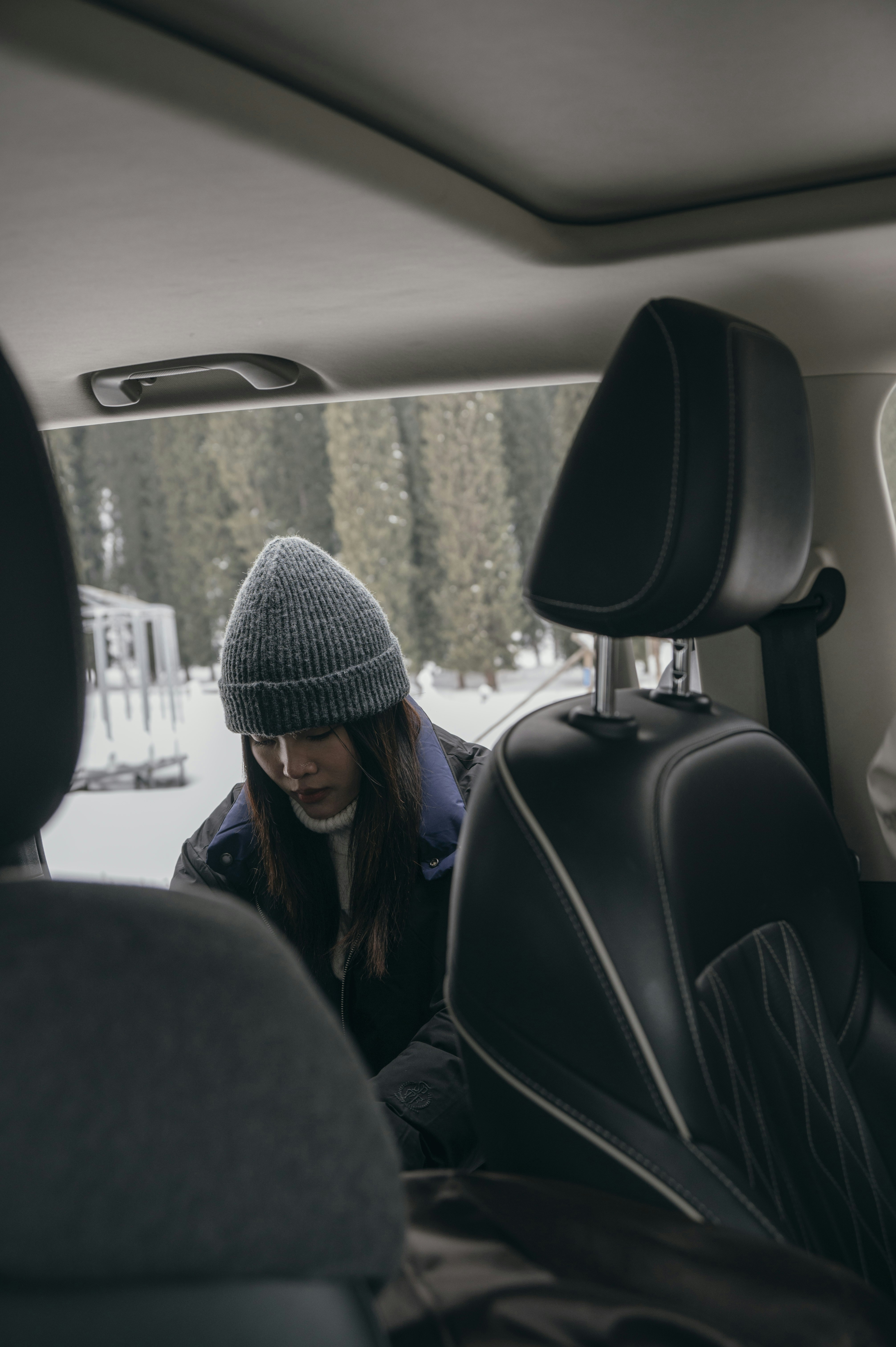 Winter Portrait in a Quiet Car: The Beanie Moment
