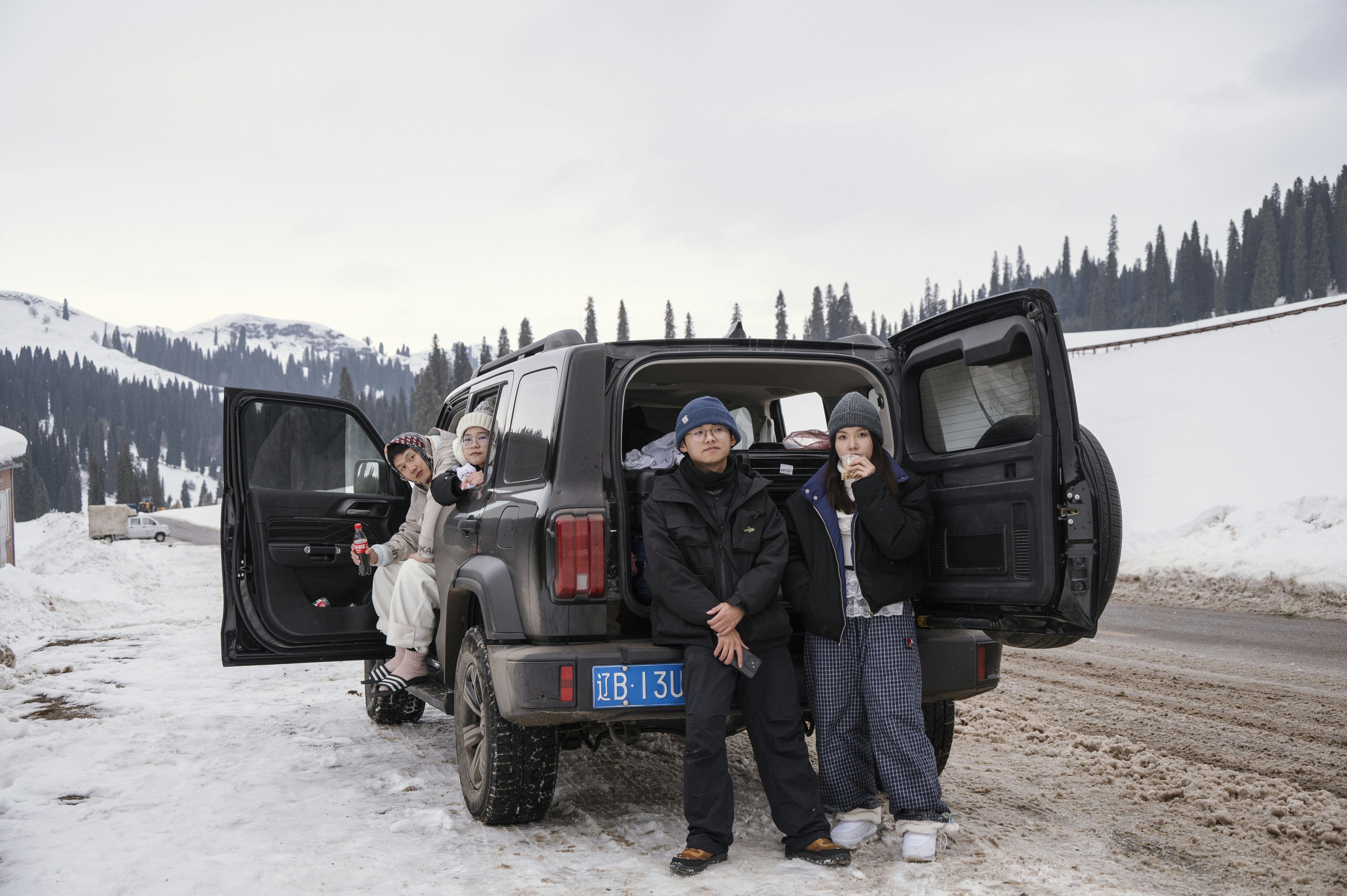 Snowbound Road Trip: A Jeep Crew Pauses Amid Snowy Pines