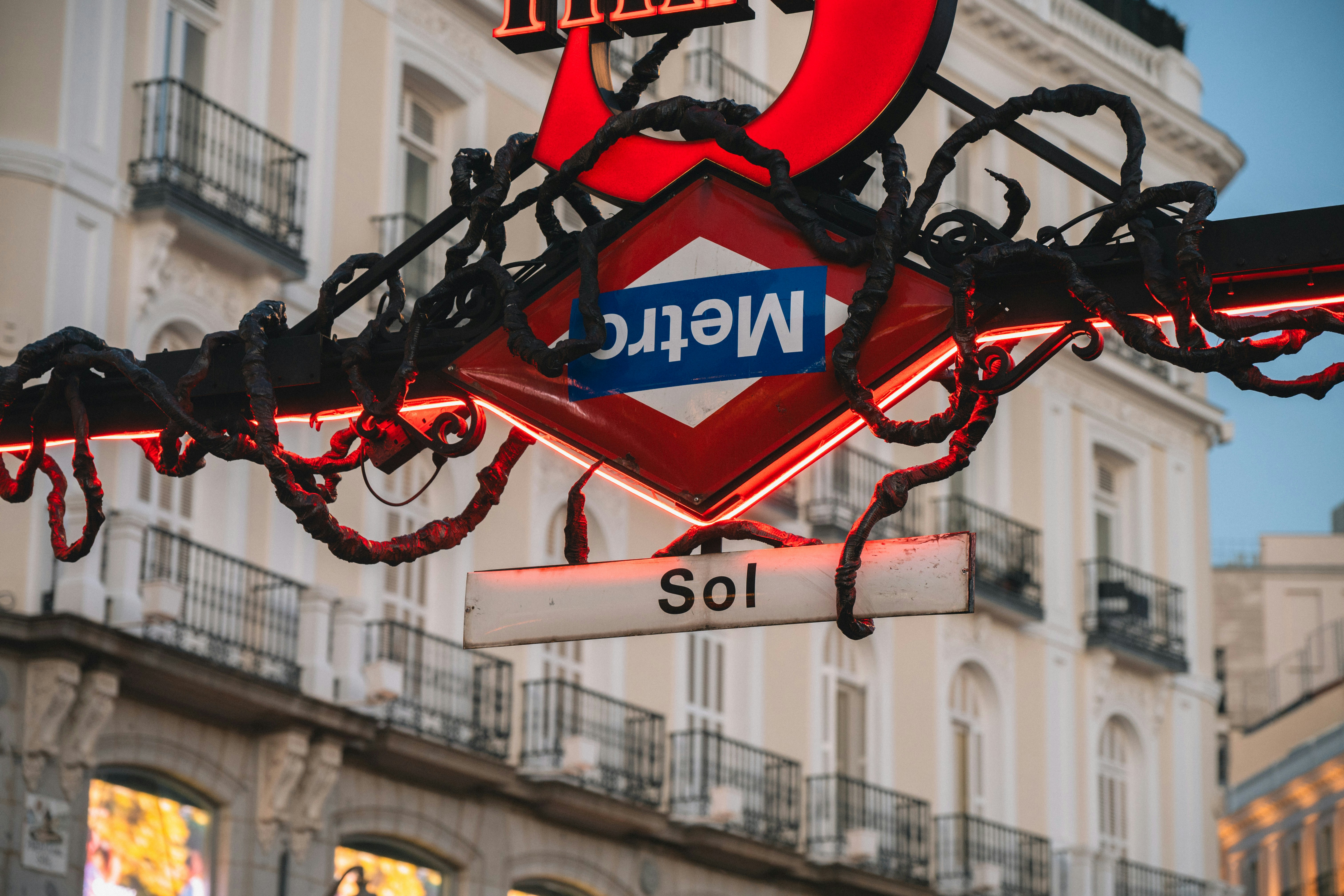 Neon Sign Reflections Over a European Street