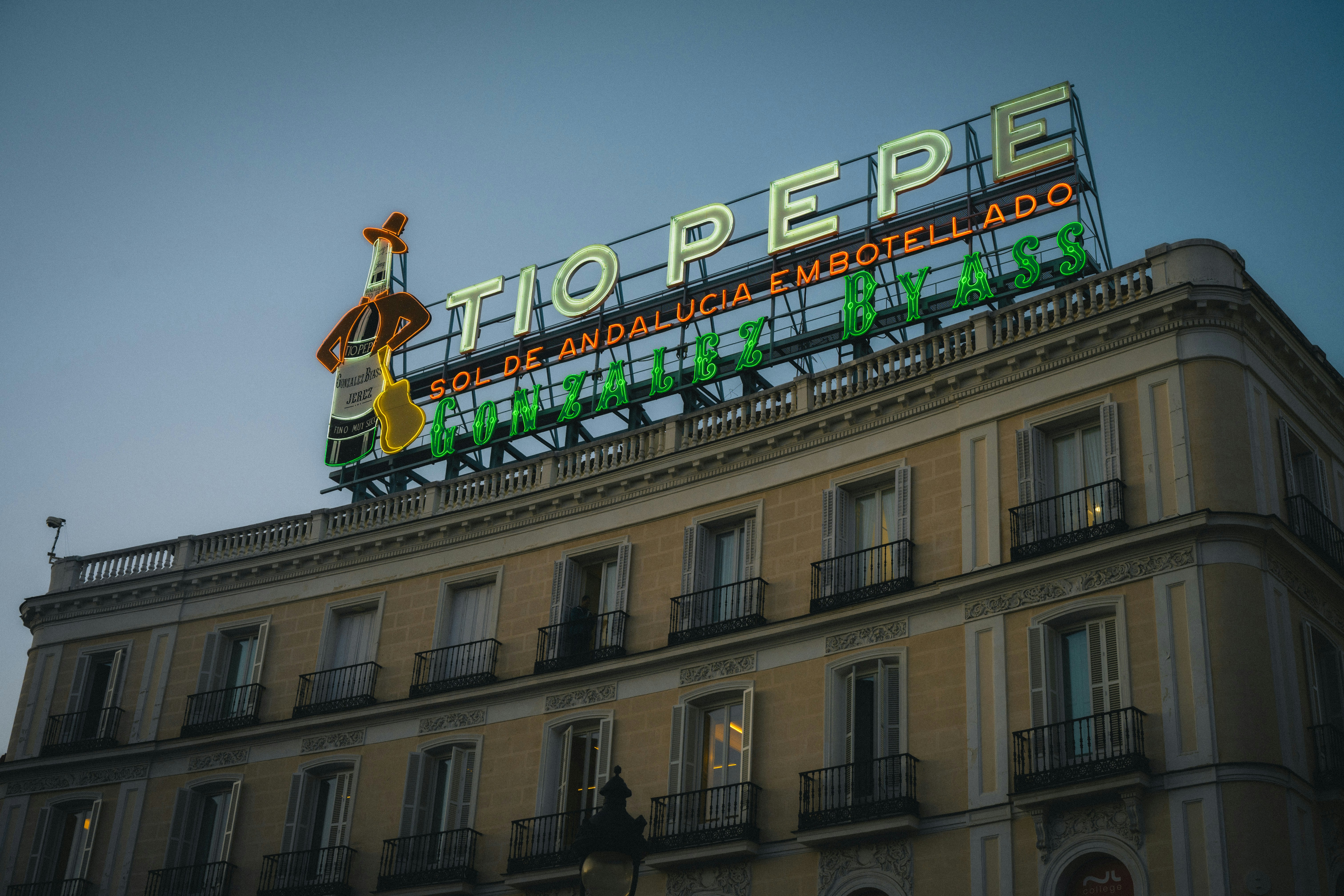 Neon Sign Over Madrid Facade