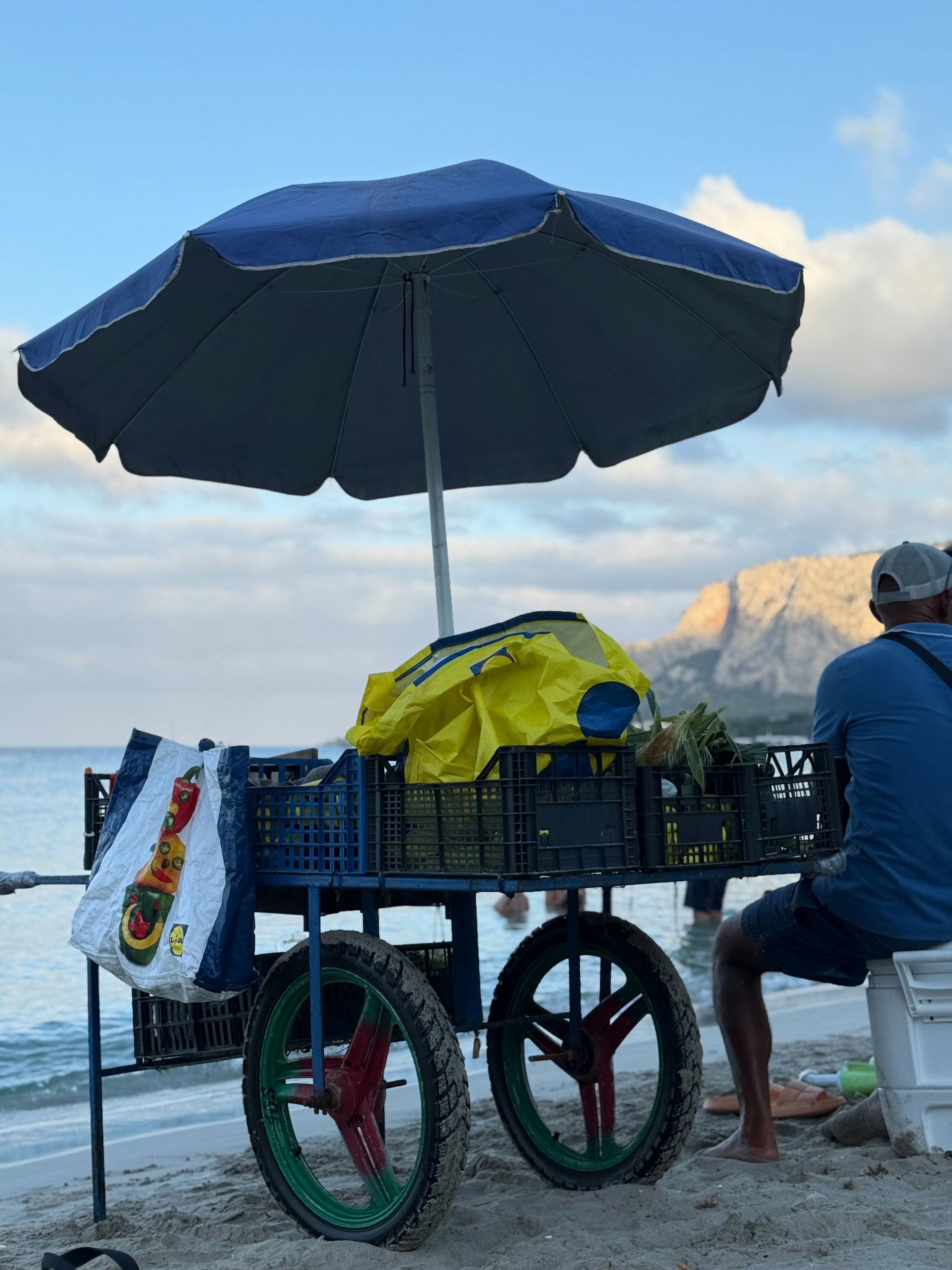 Beachside Cart of Colors: Umbrella, Crate, and Sea Breeze