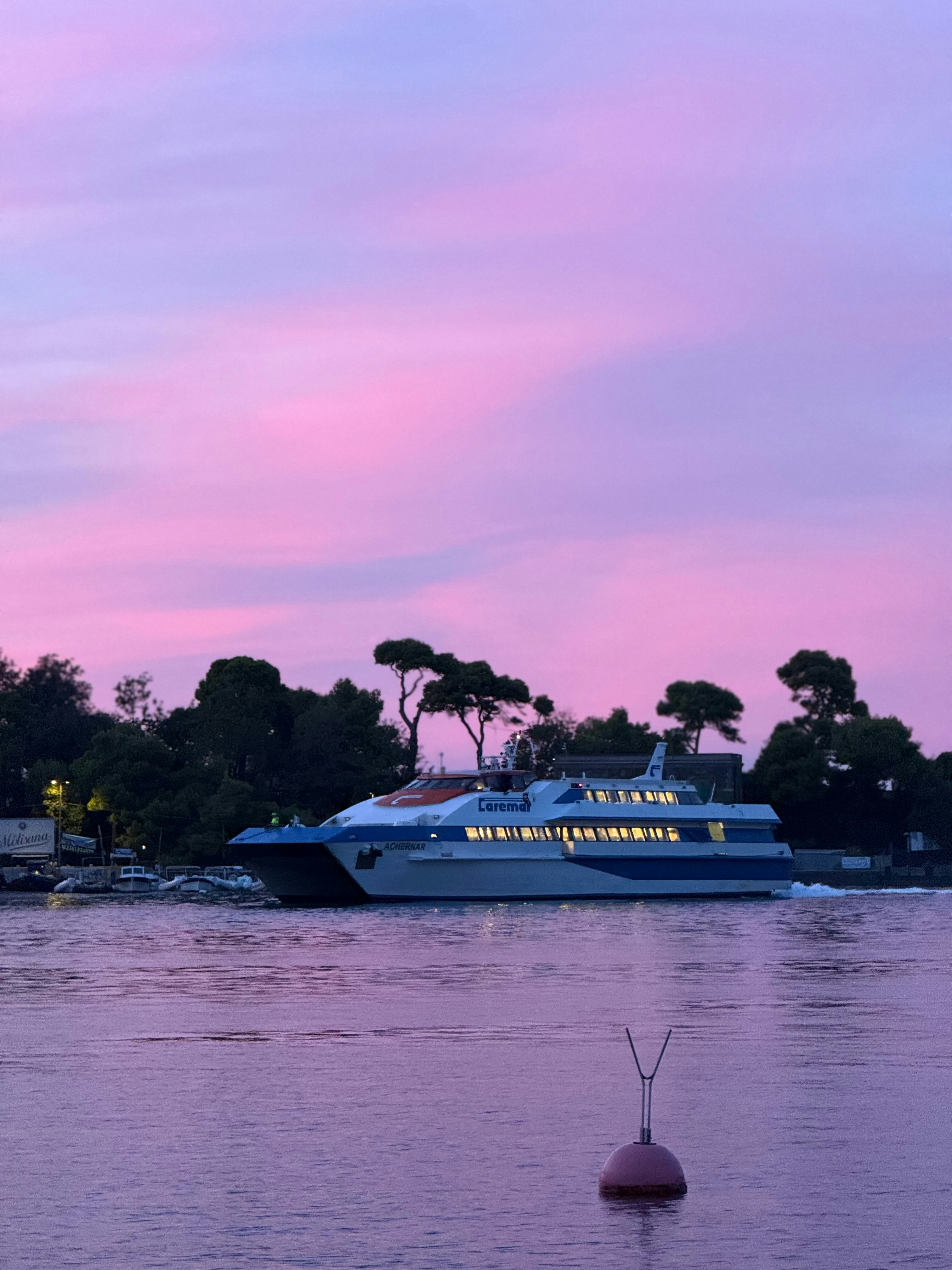 Evening Vessel: A Pink-Hued Sunset Basks a Quiet Marina
