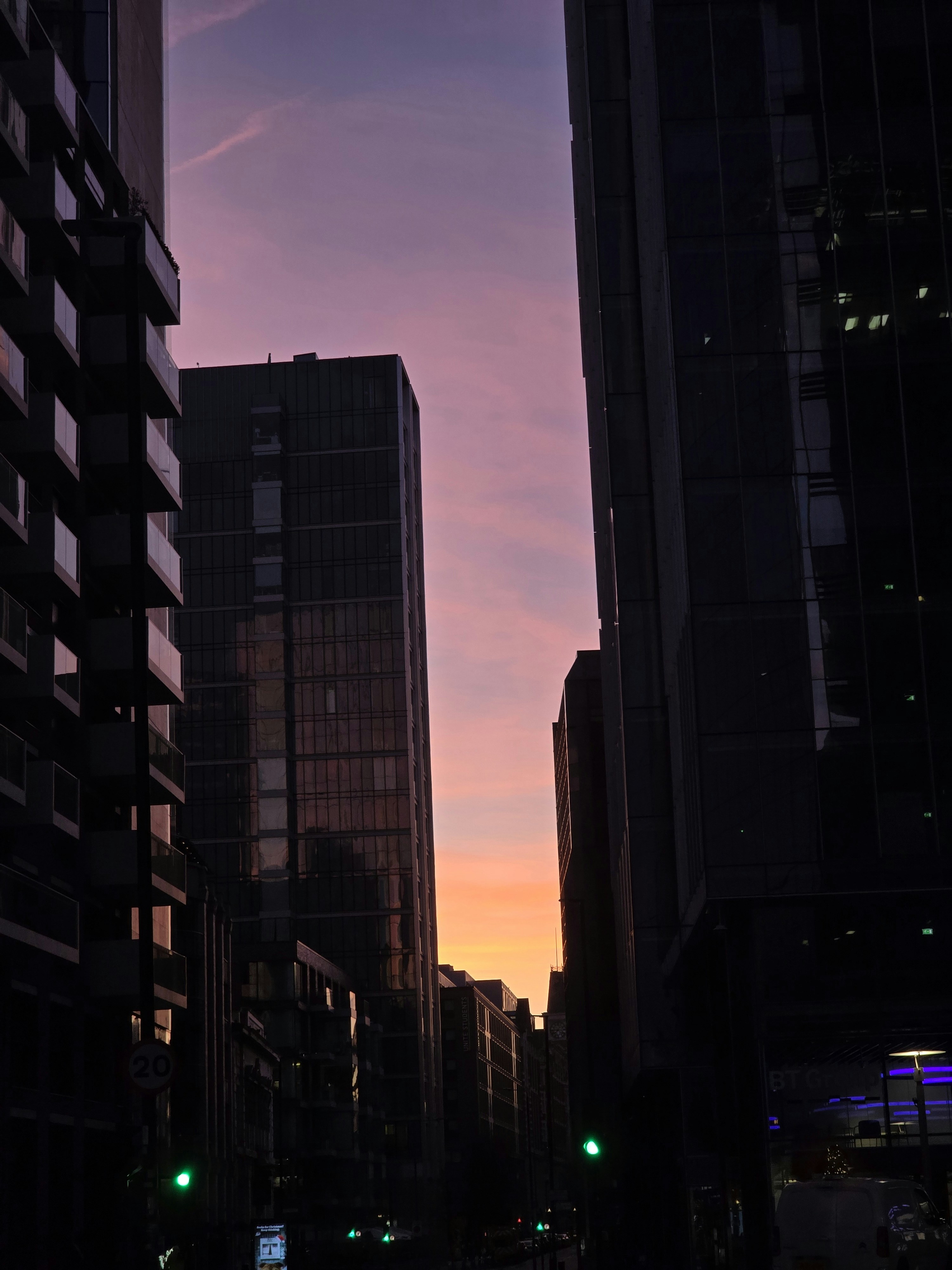 Sunset Between Skyscrapers: Neon Sparks in a Narrow City Canyon