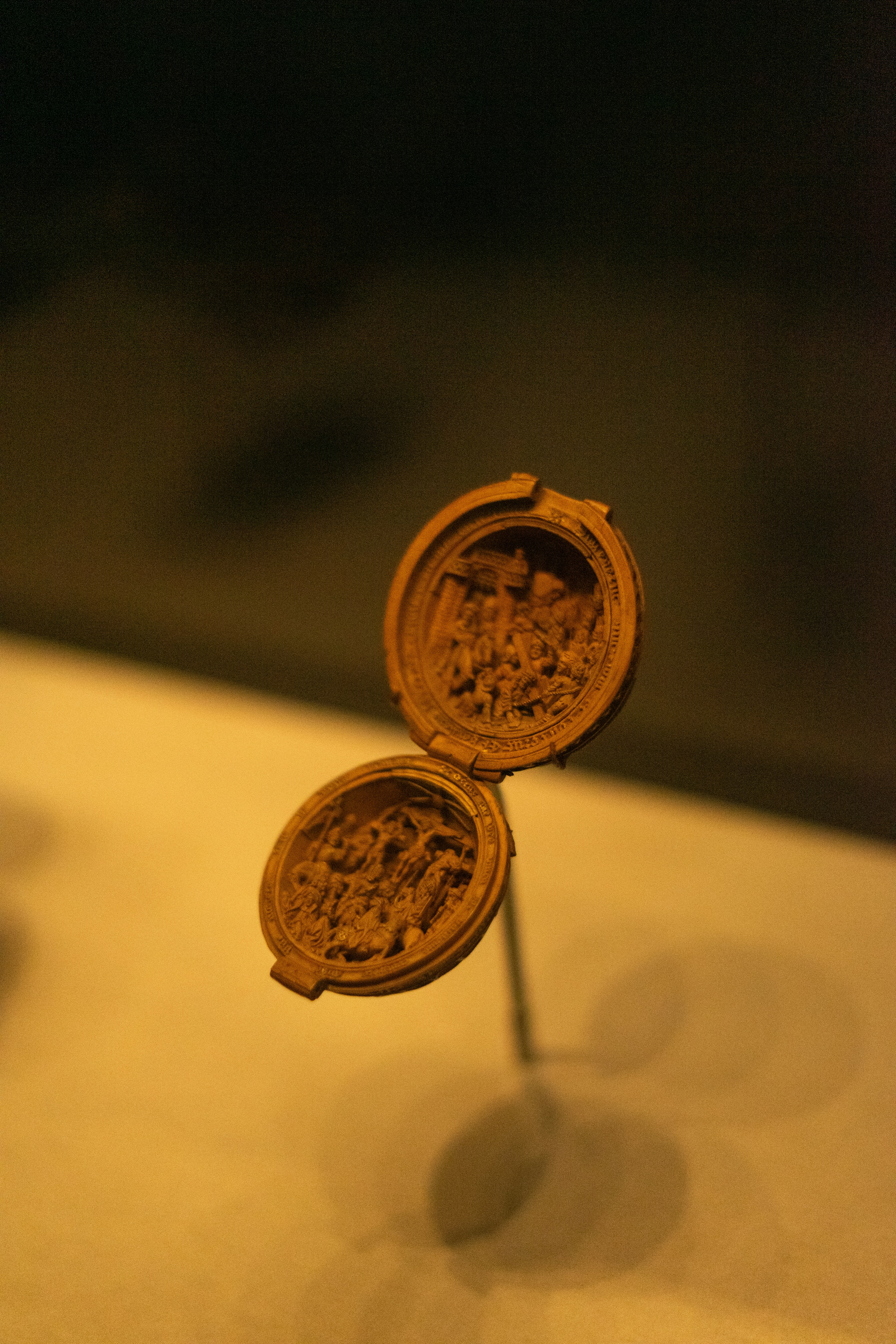 Miniature Coin Pendant on a Tilted Stem
