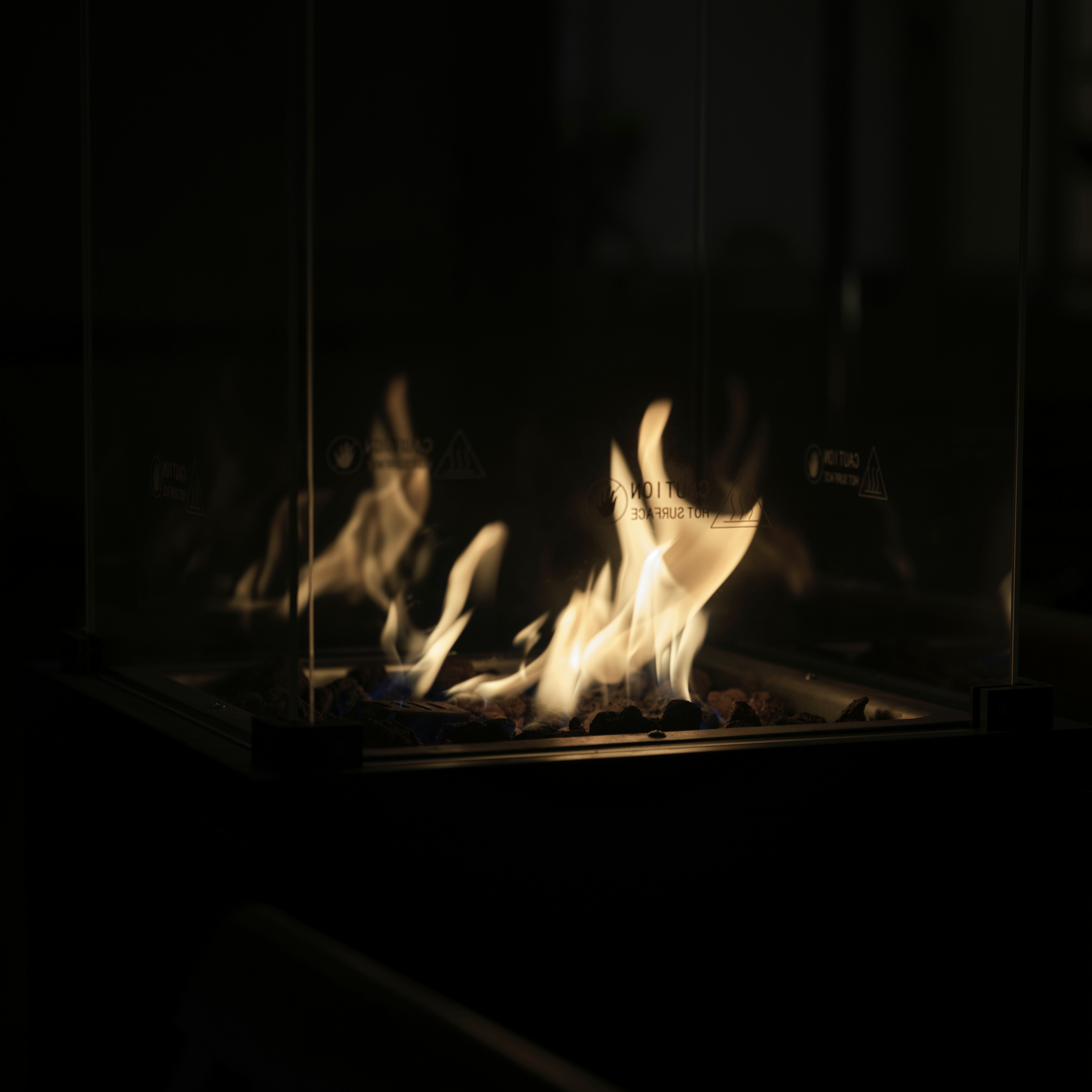 Flames burning in a modern glass fireplace