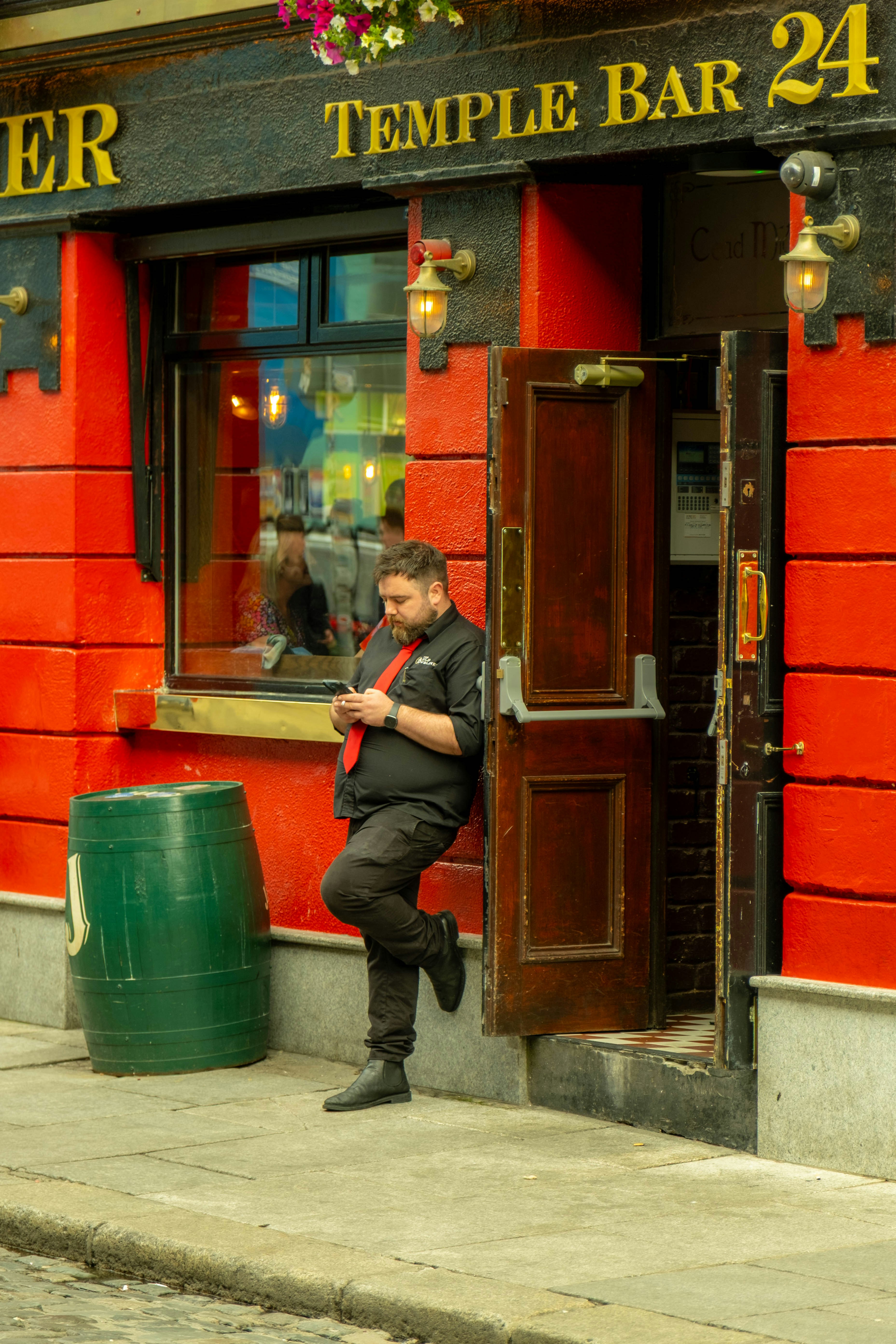 Business Casual Pause Outside a Red Brick Pub