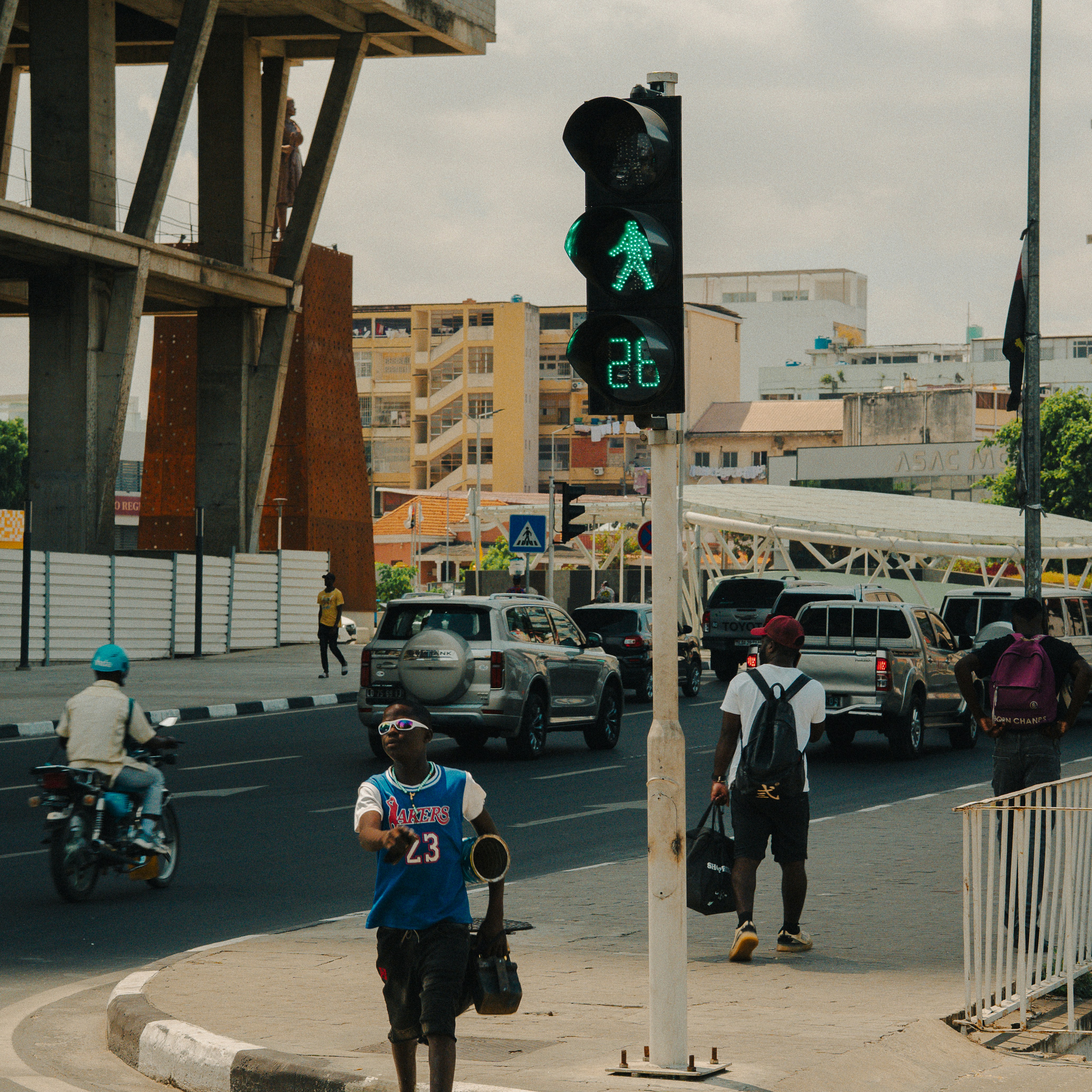Crosswalk Pulse: A City Stroll Beneath the Green Walk Signal