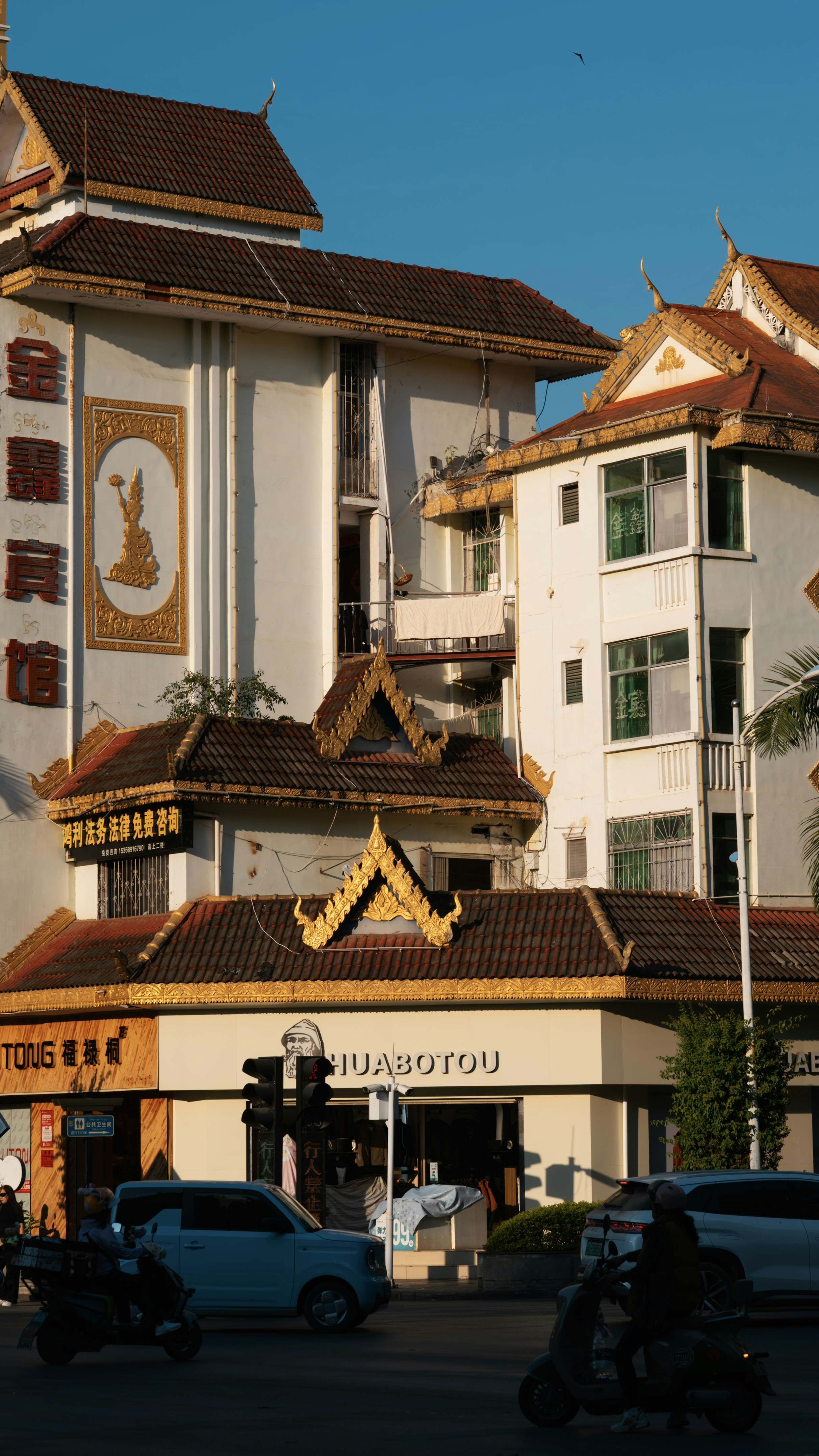 Golden Rooflines and Streetlife: A Vue of Temple-Adjacent Shops in Soft Autumn Light