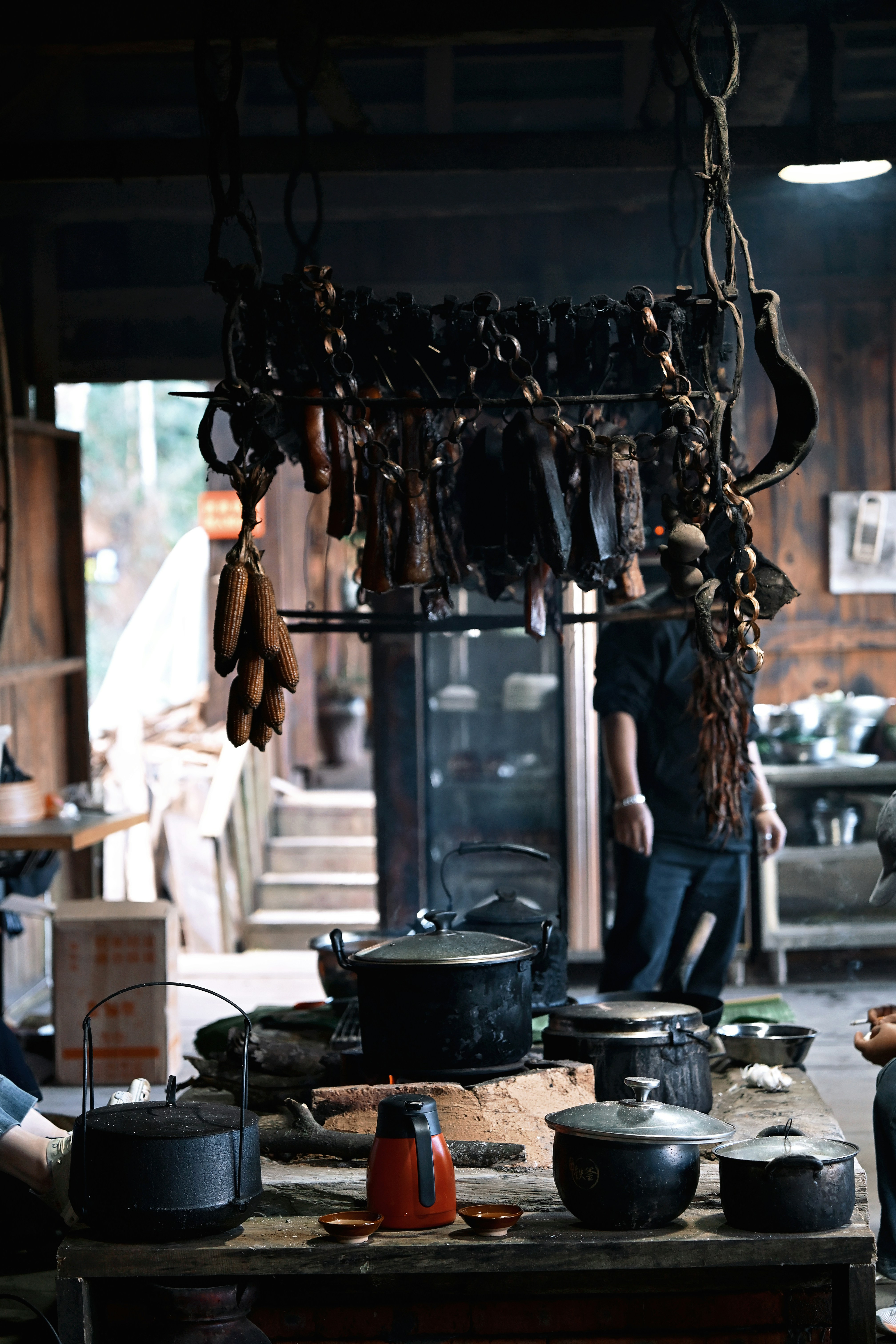 Hanging Charms and Pot Stove in a Rustic Kitchen
