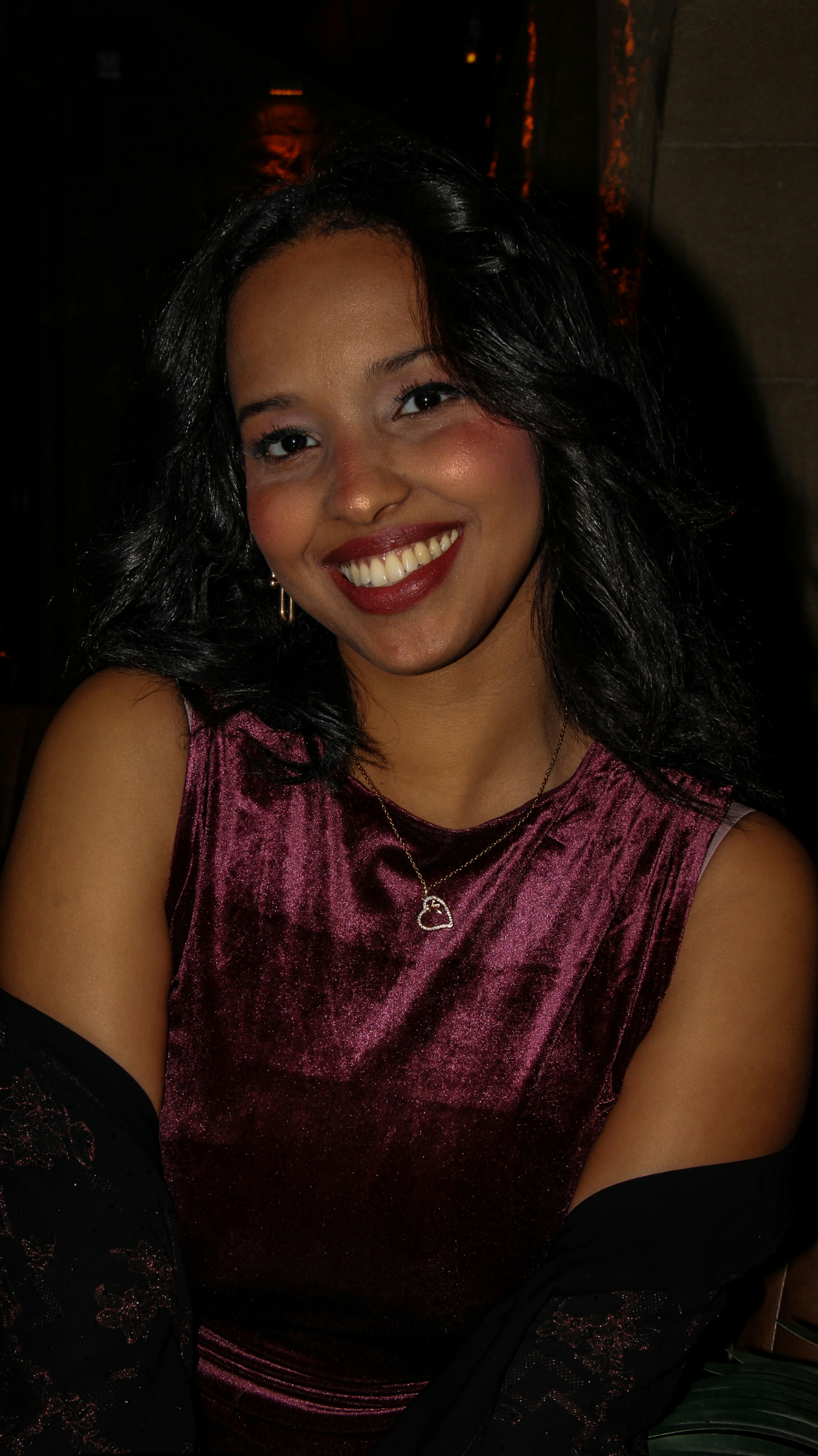 Velvet Night: A Warm Smile Under Dim Club Lights