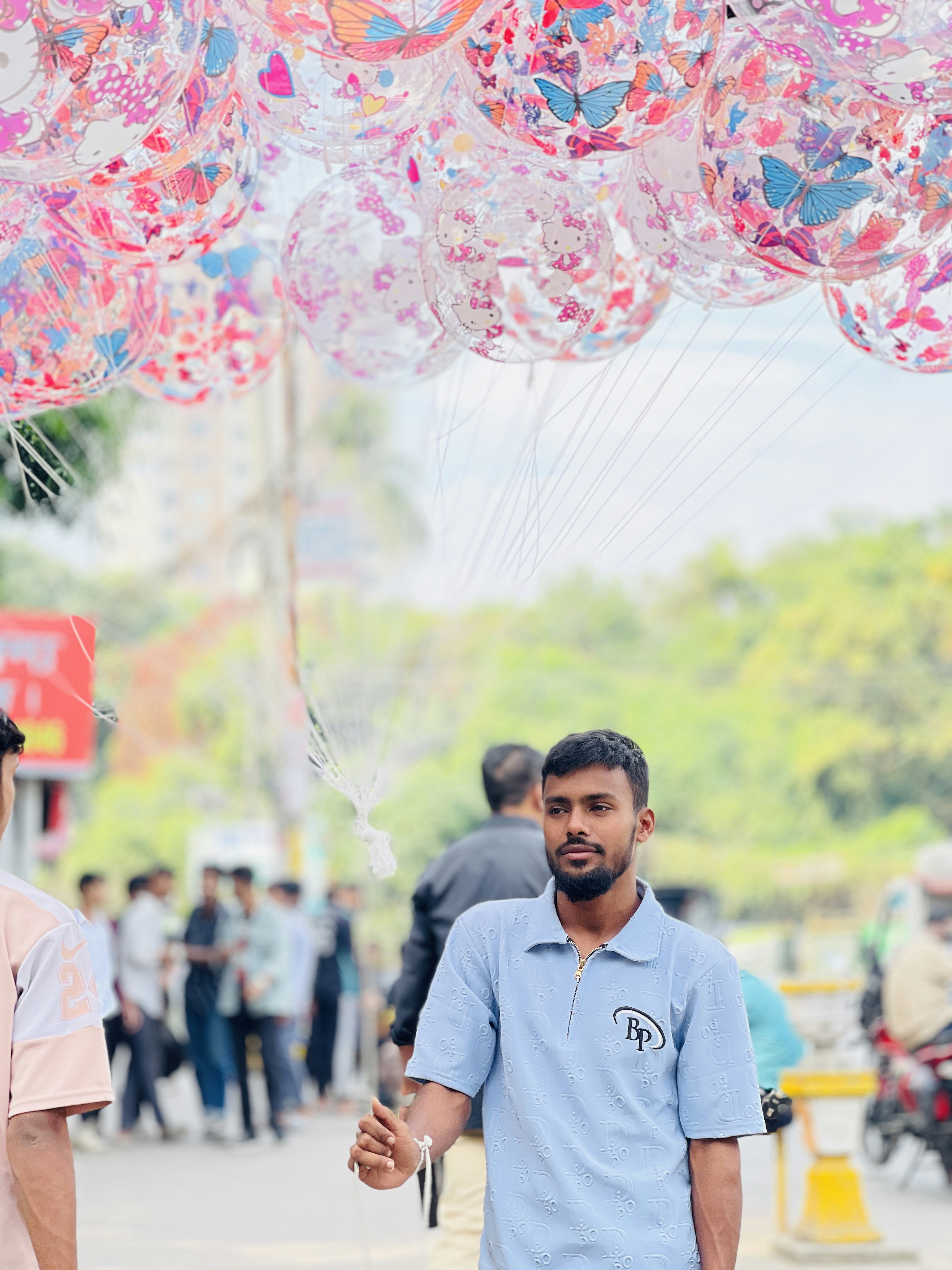 Balloon Burst Portrait: A Calm Moment Under Floating Color