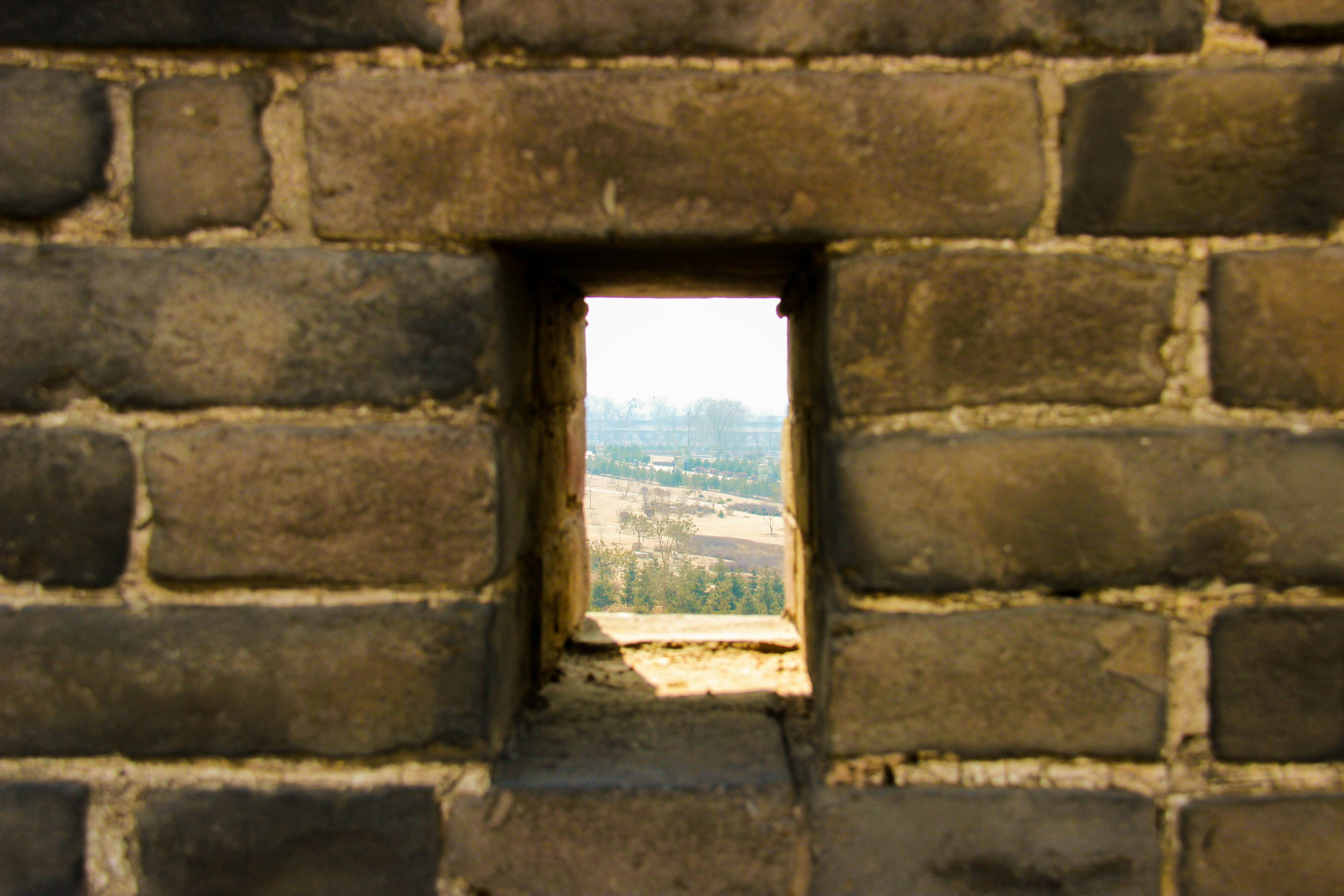 A Narrow View: Framed Aperture in a Weathered Wall