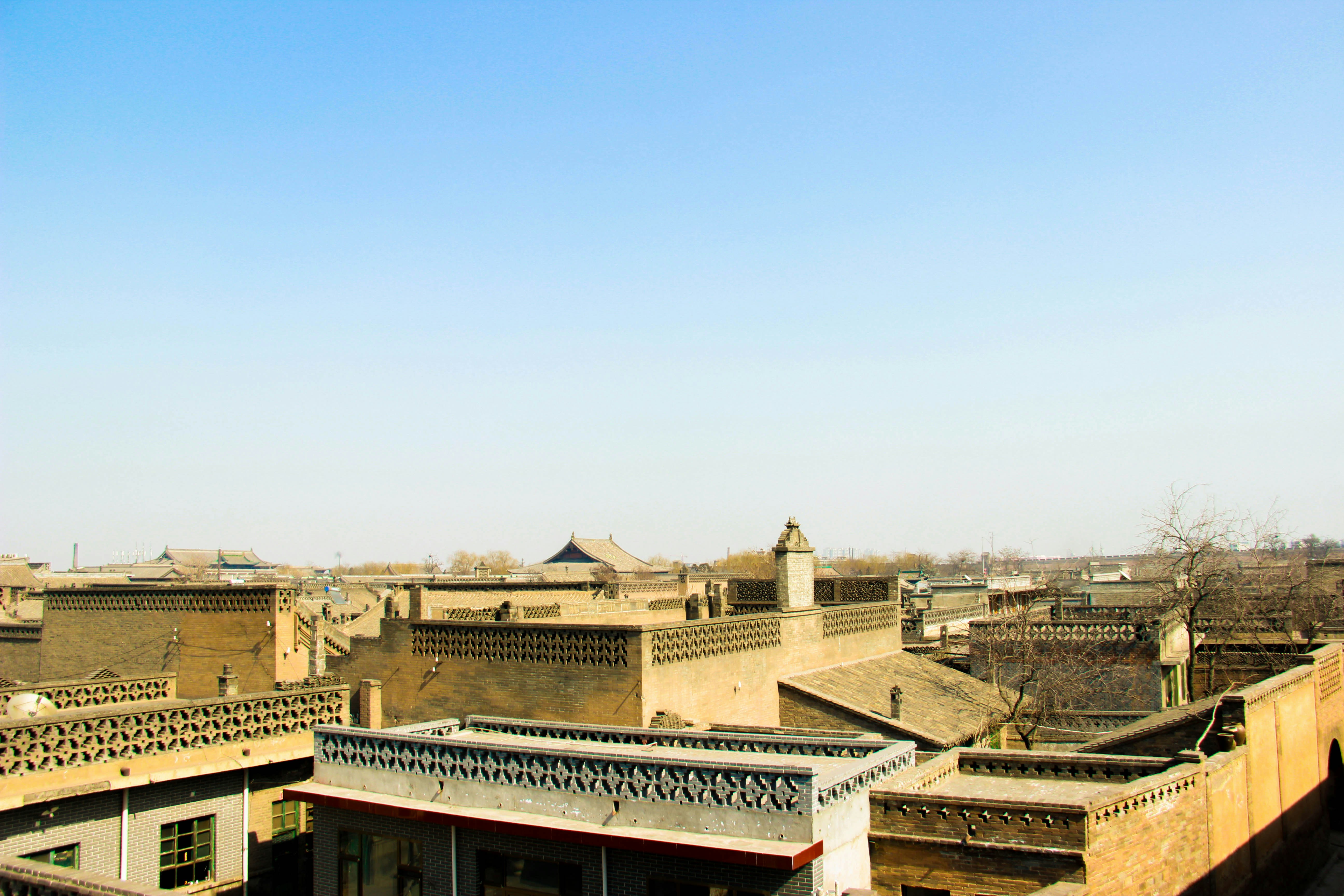 Earth-Toned Rooftops Under a Pristine Blue Sky