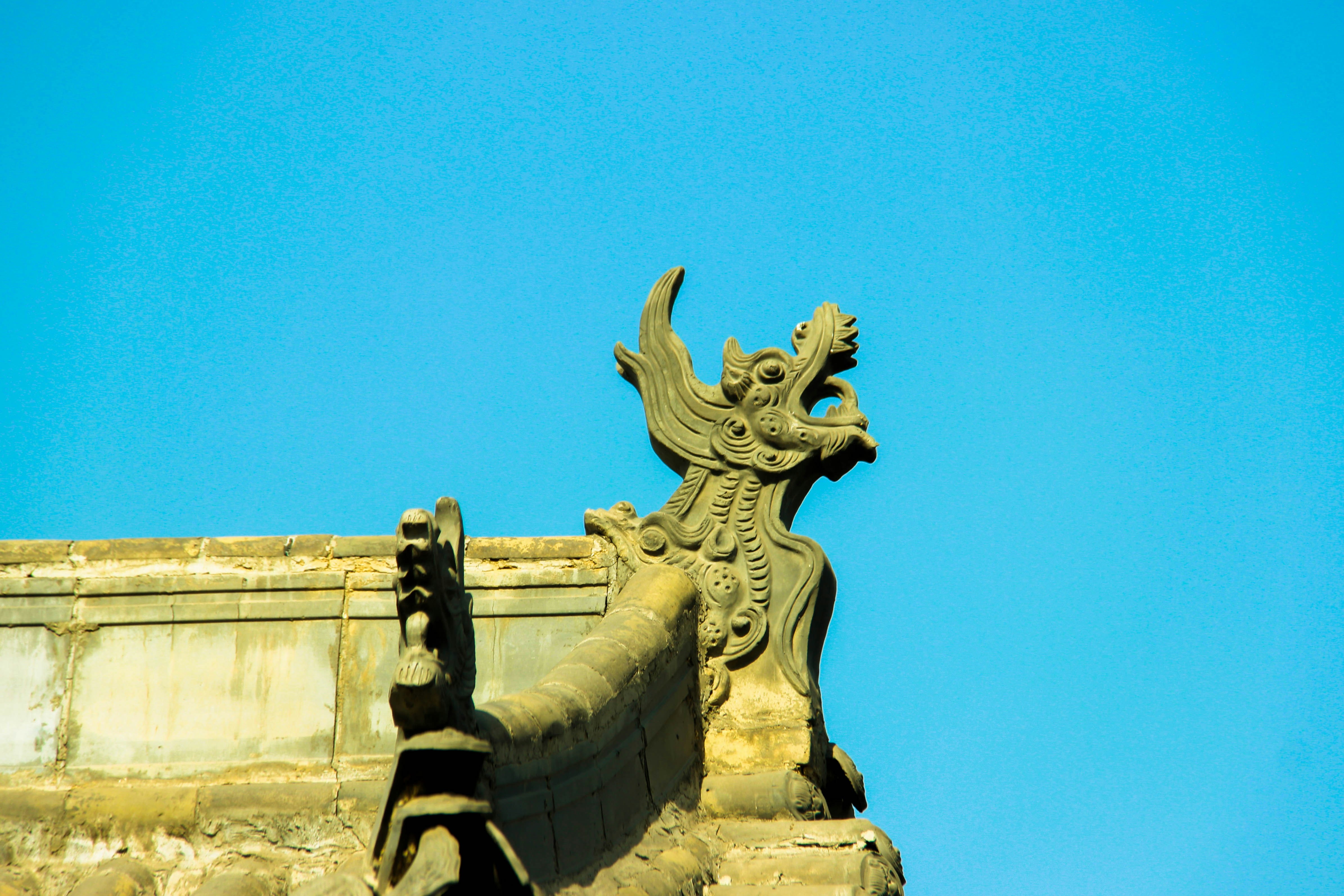 Stone Dragon Crest Against a Cerulean Sky