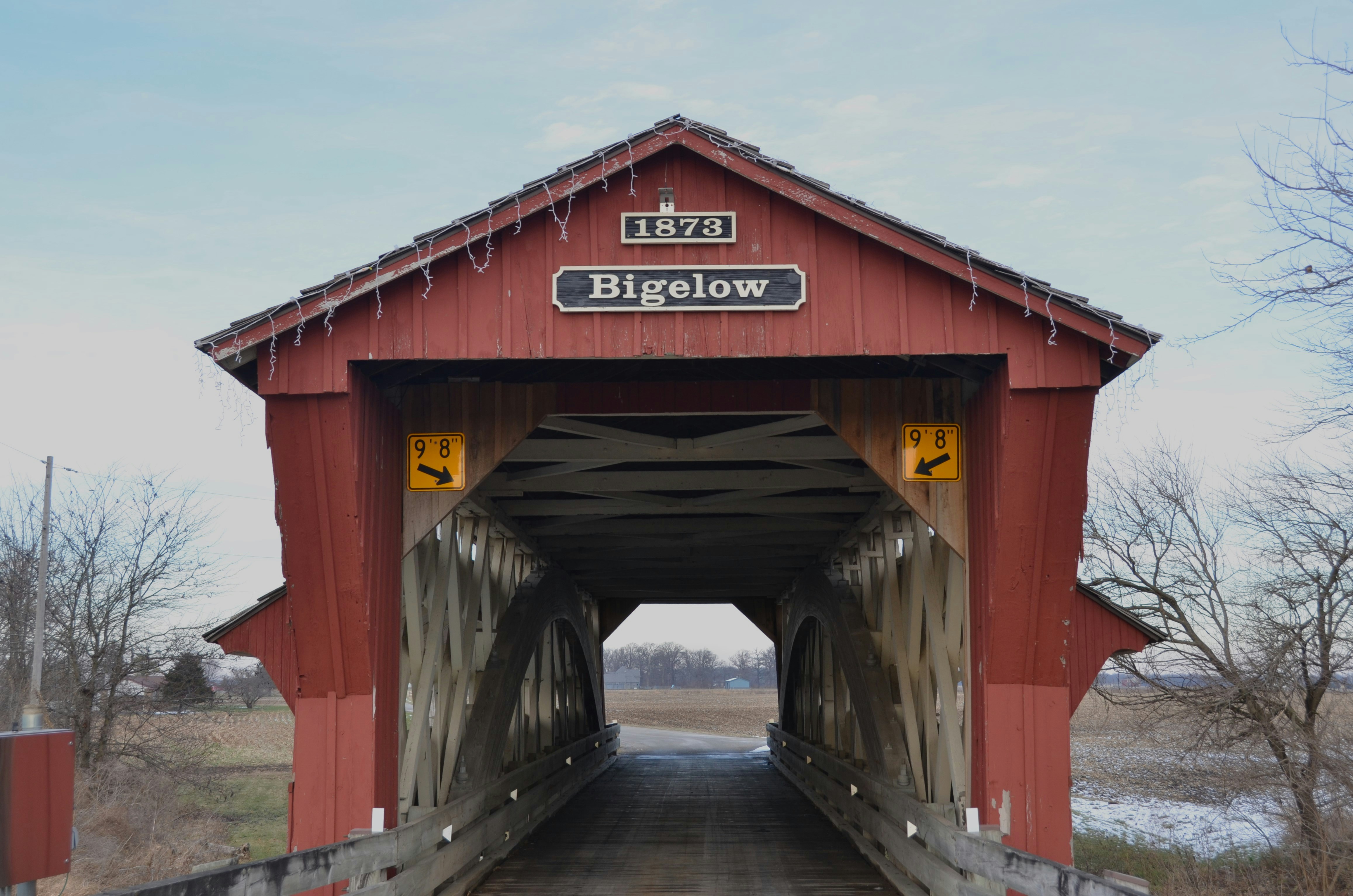 Red Covered Bridge Reading Light through Wooden Arches