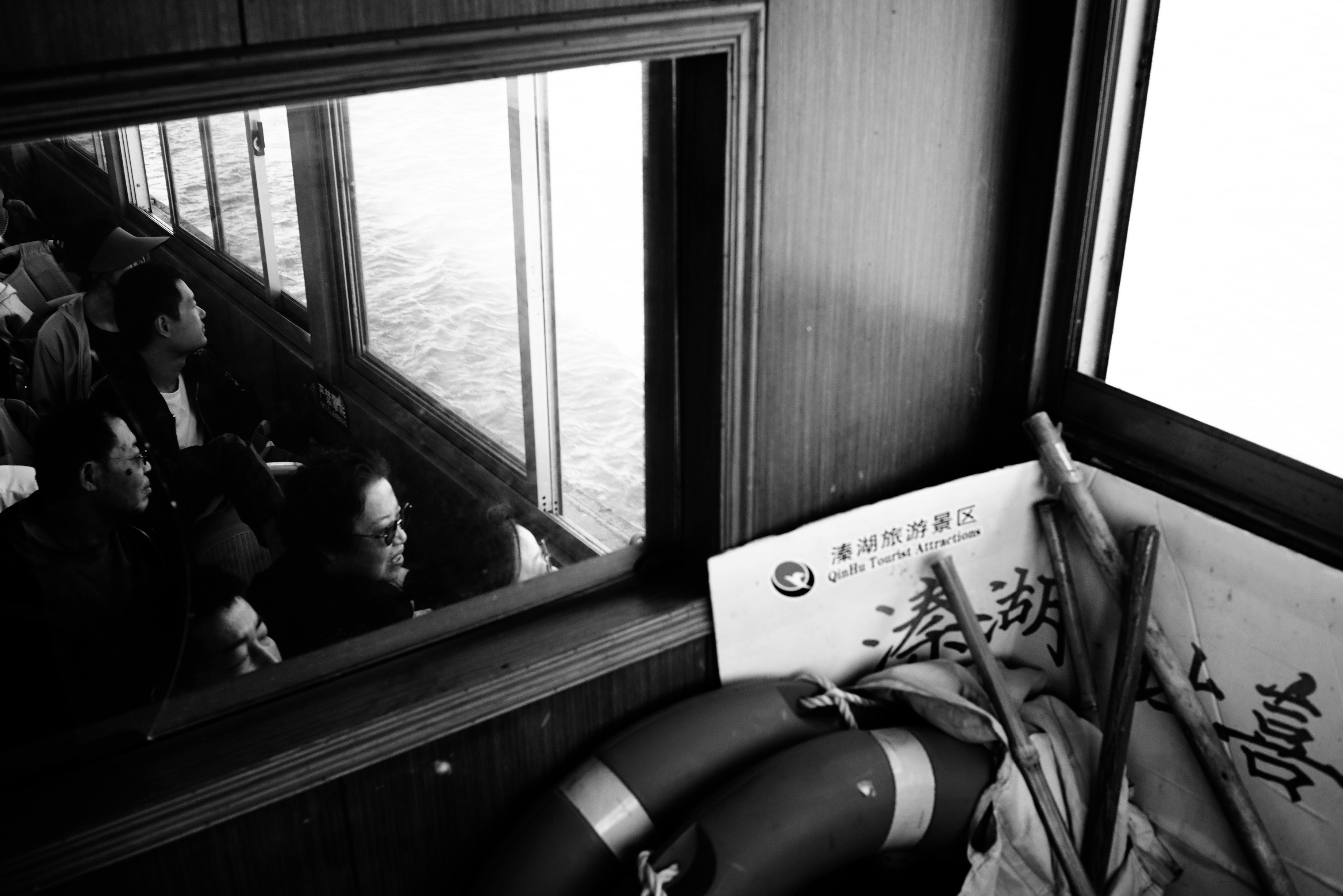 Windowed Passengers: A Quiet Gaze Beyond the Porthole
