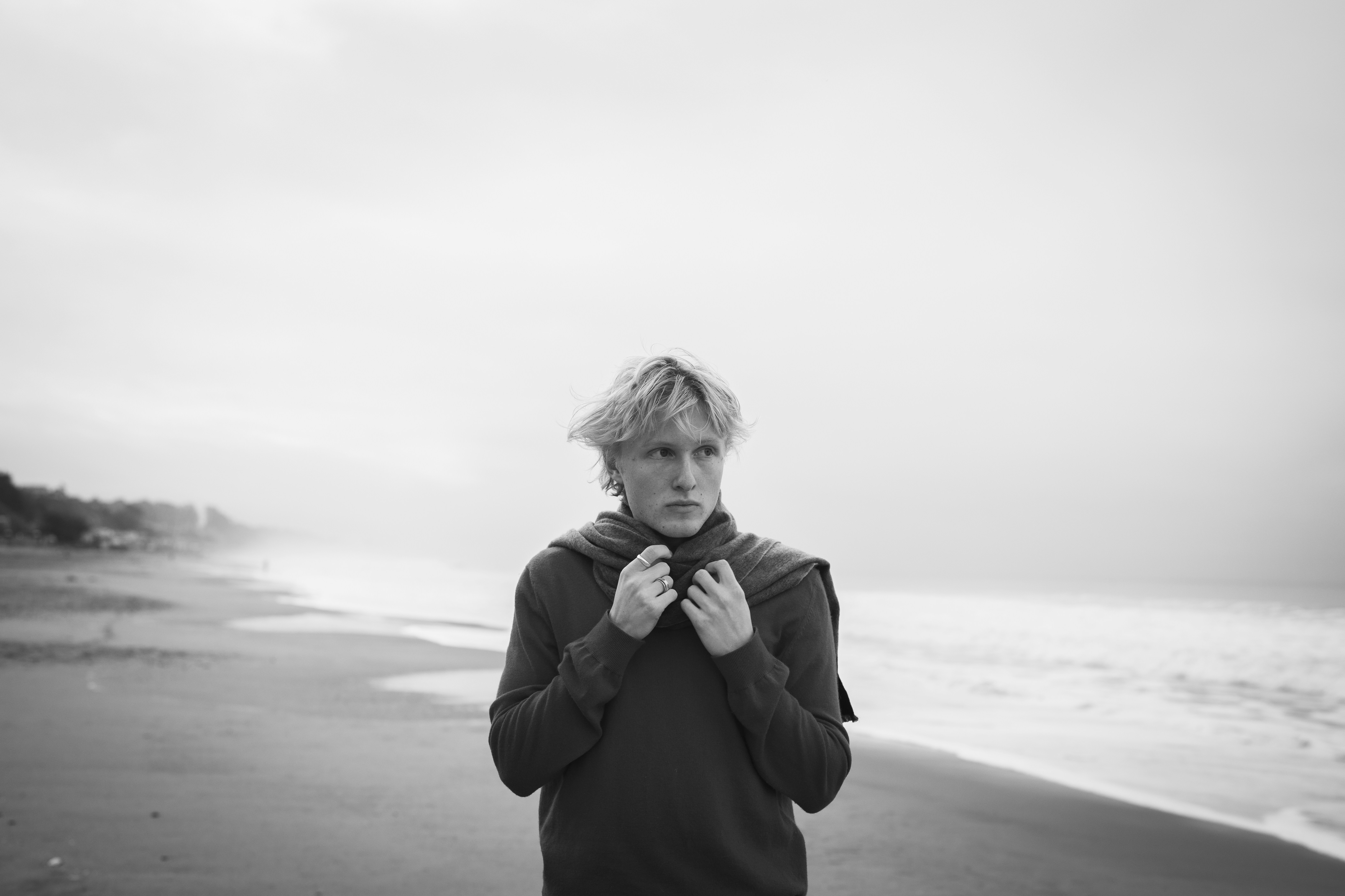 Stormy Quiet: A Youthful Figure On a Misty Beach