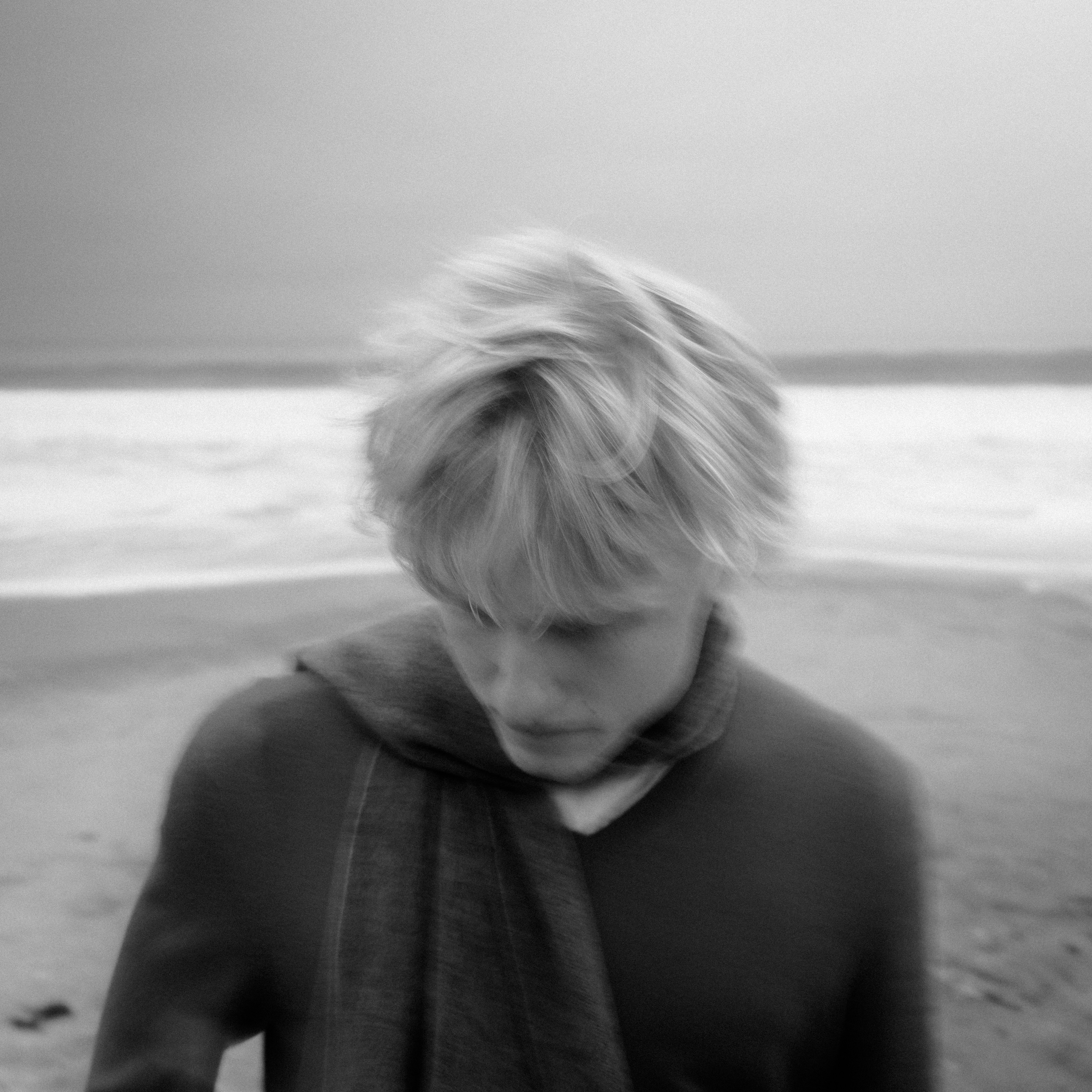 Soft Blur on a Quiet Shore: A Portrait in Mono