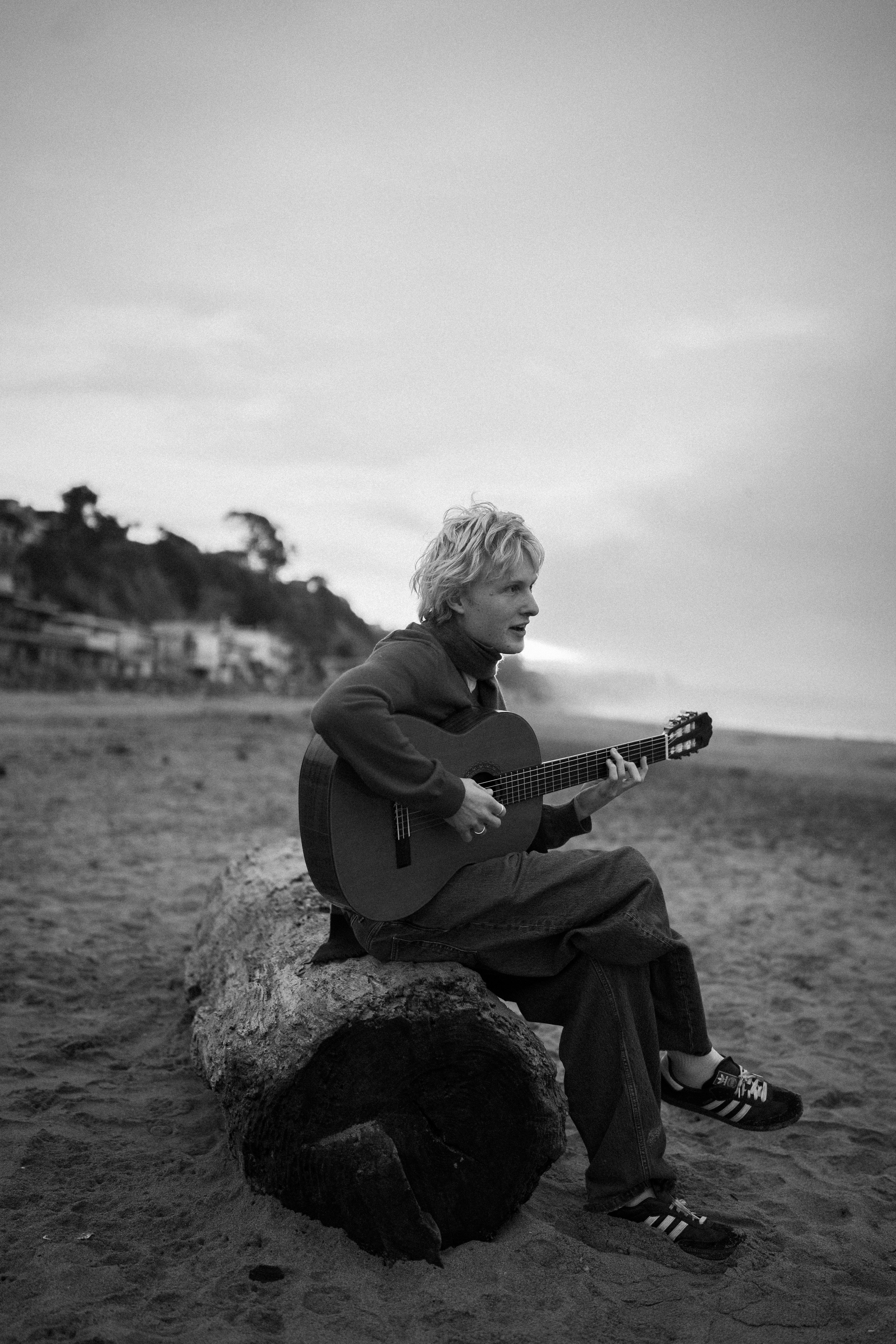 Guitar on the Sea: A Quiet Portrait by the Shore