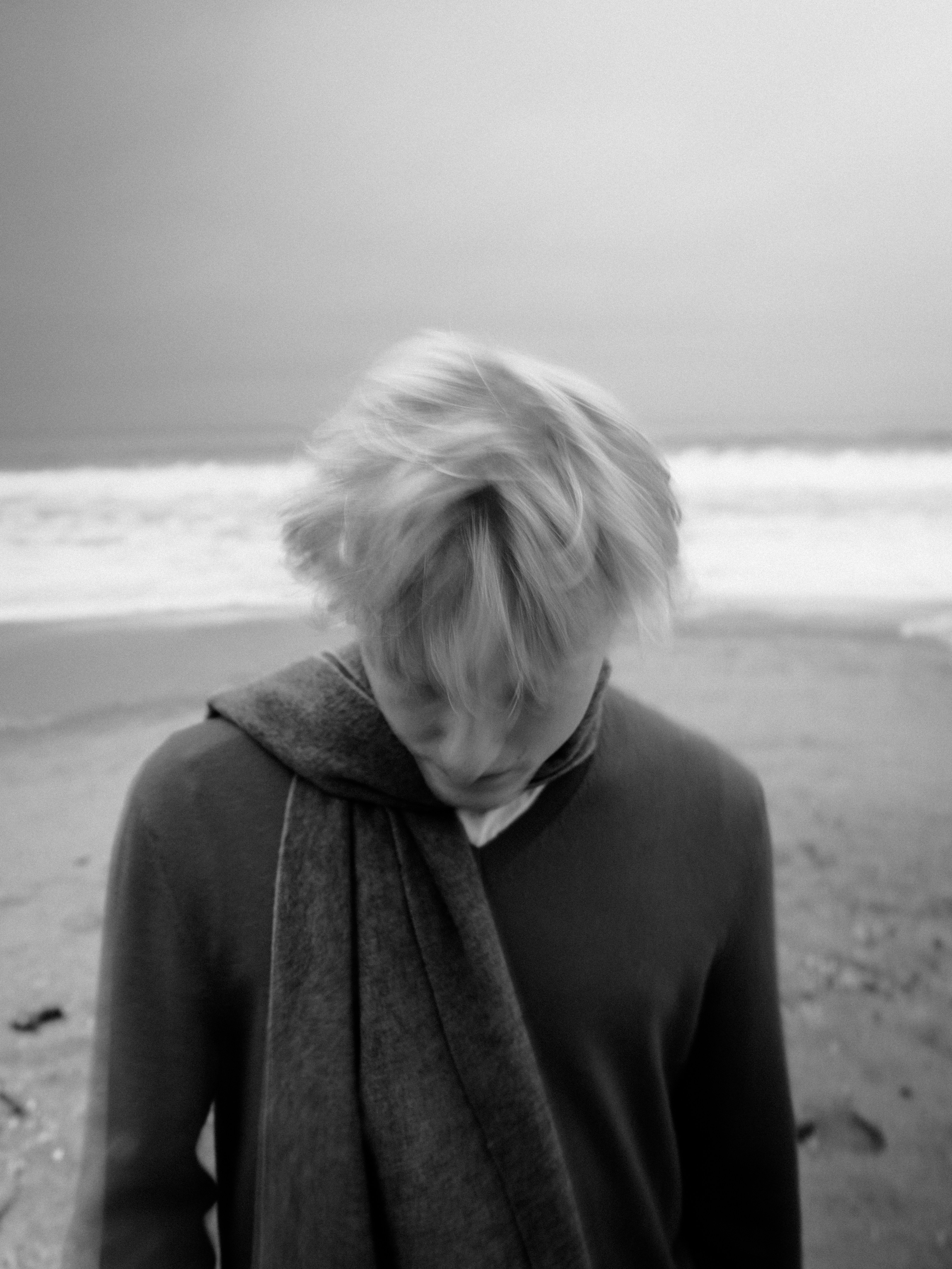 Blurry Horizon: A solitary portrait on windswept shore