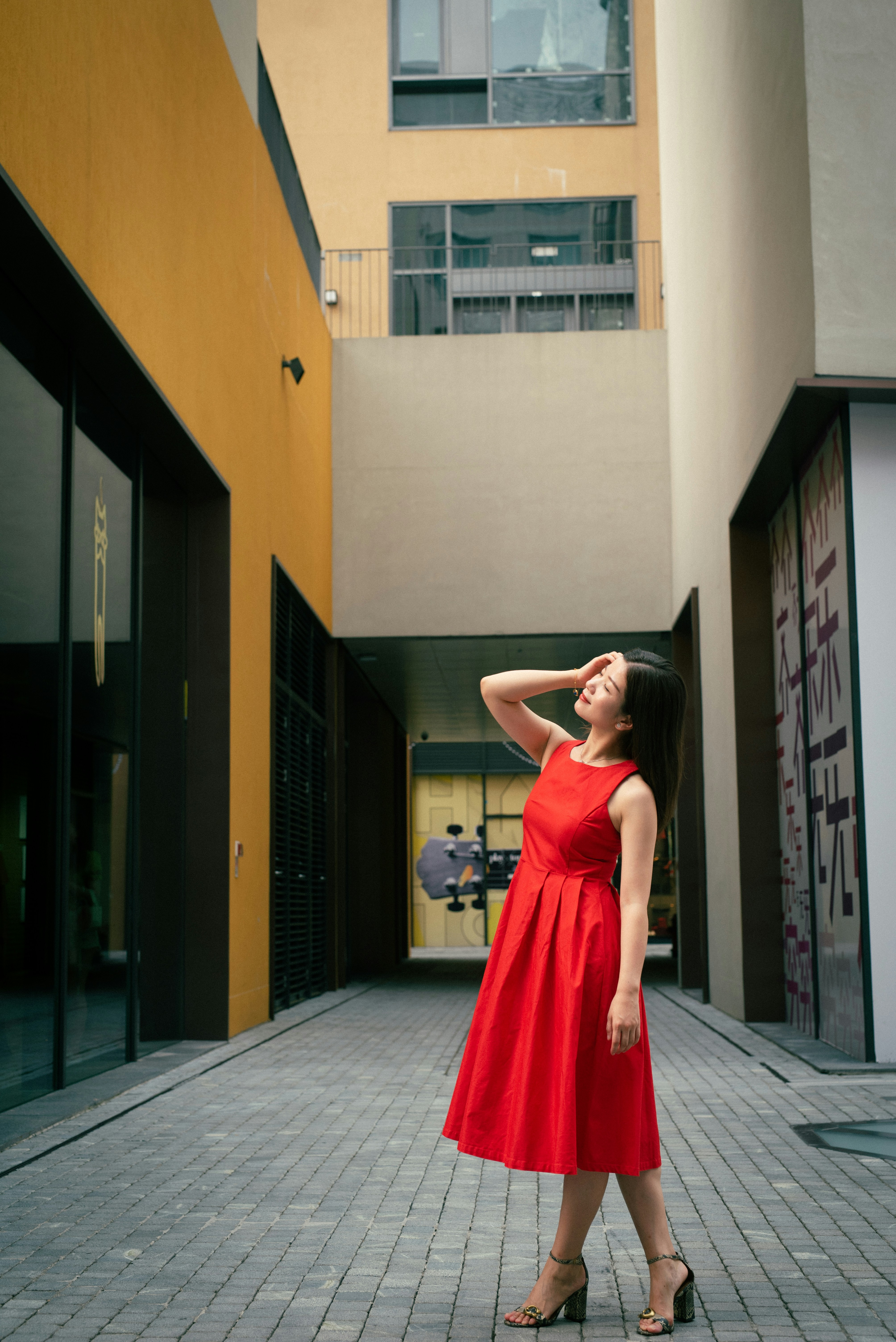 Red Dress in a Quiet Urban Passage