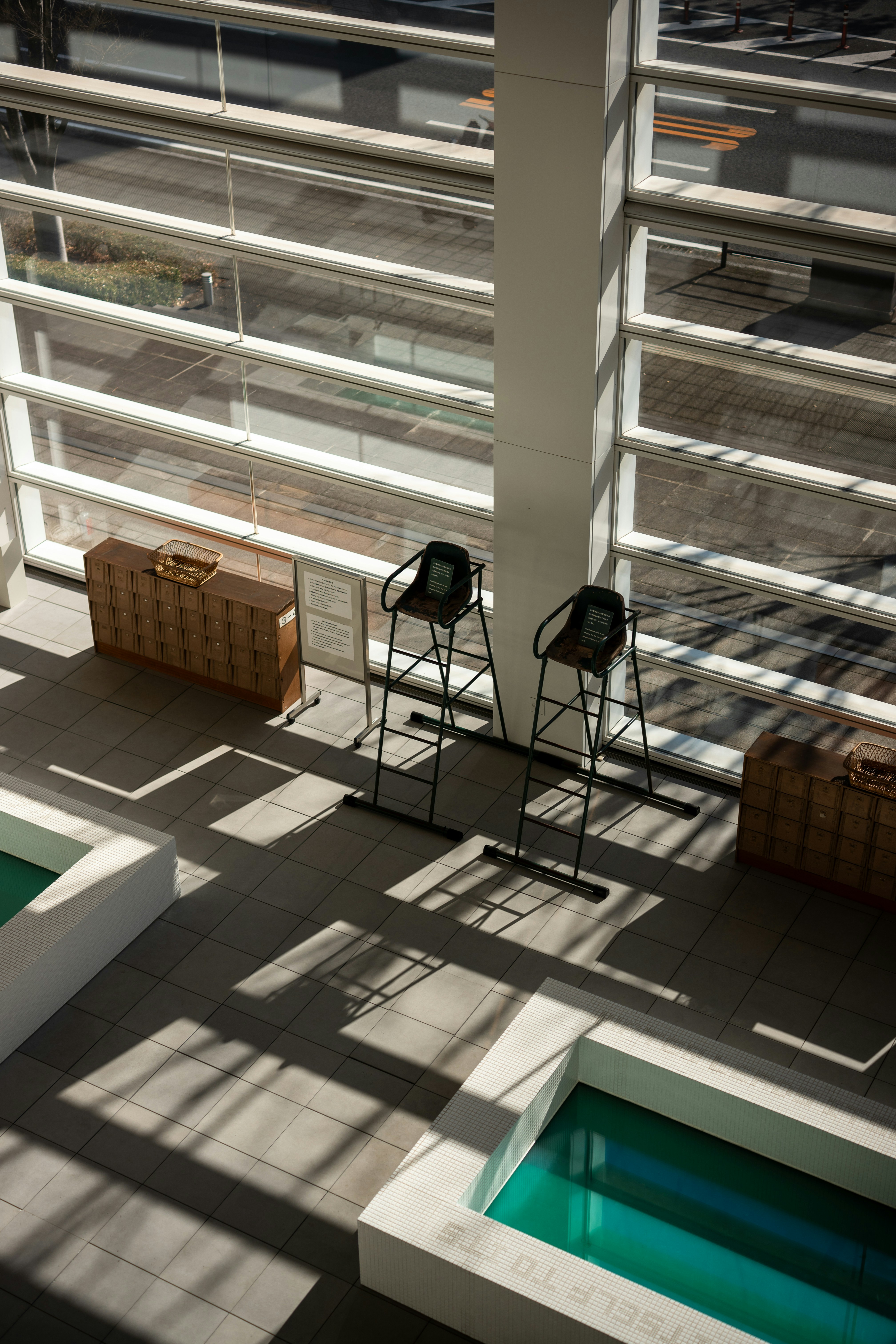 Sunlit Atrium Shadows over Modern Pools