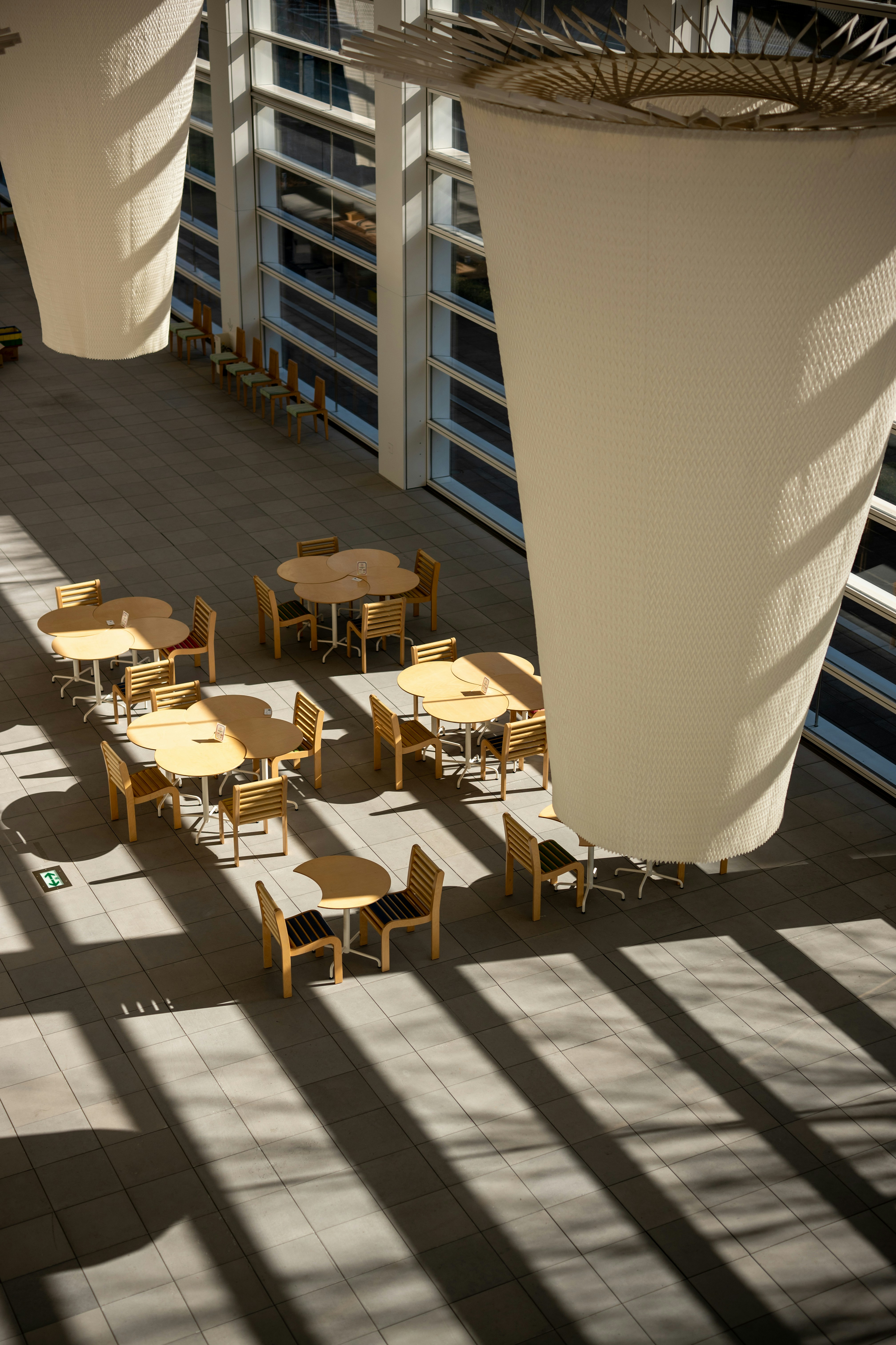 Sunlit Courtyard Alcove: Assembly of Tables and Shadows