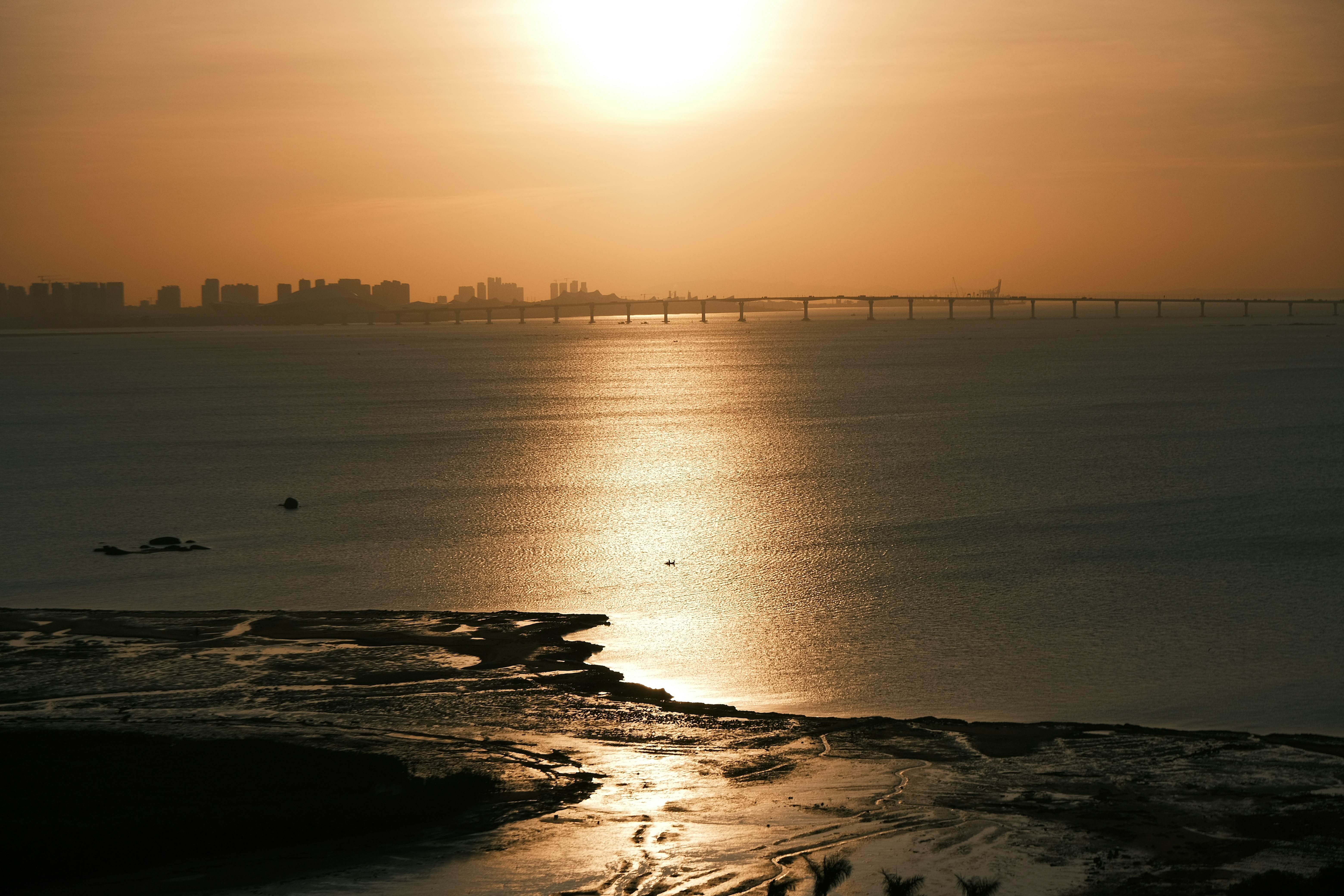 Golden Path: Sunset on a Quiet Coastal Horizon