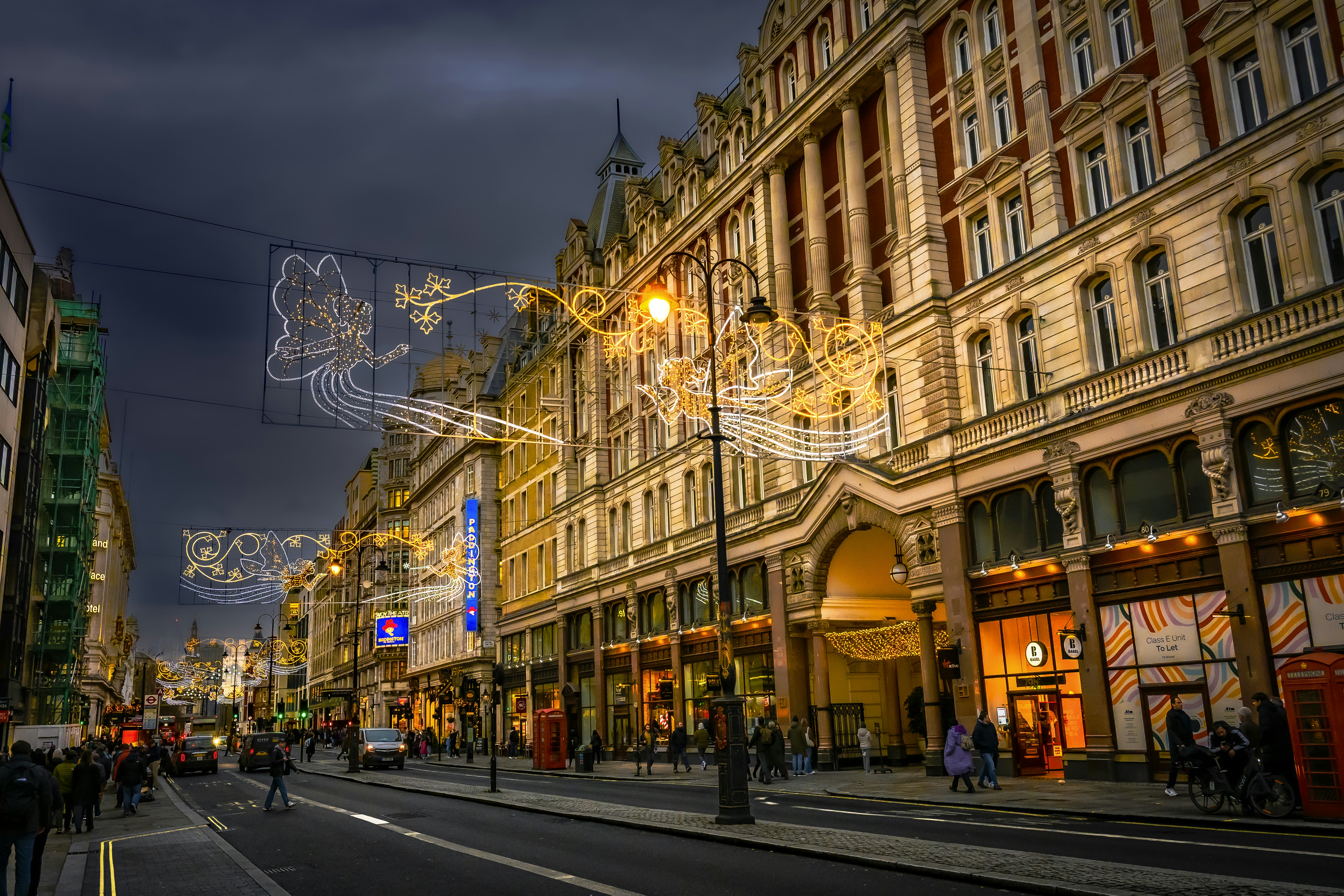 Festive city glow: illuminated street with ornate overhead decorations