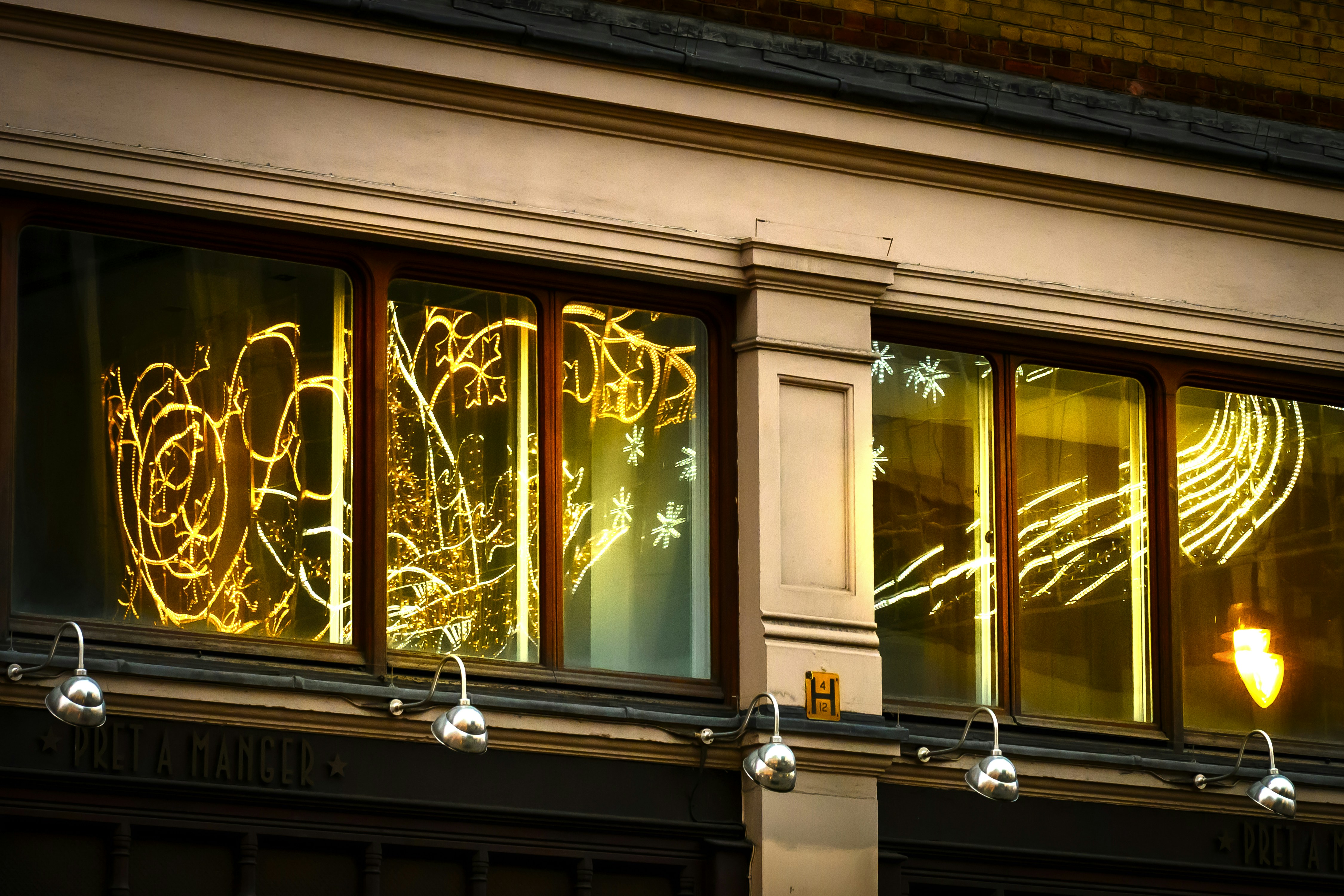Golden Light Reflections on a City Facade